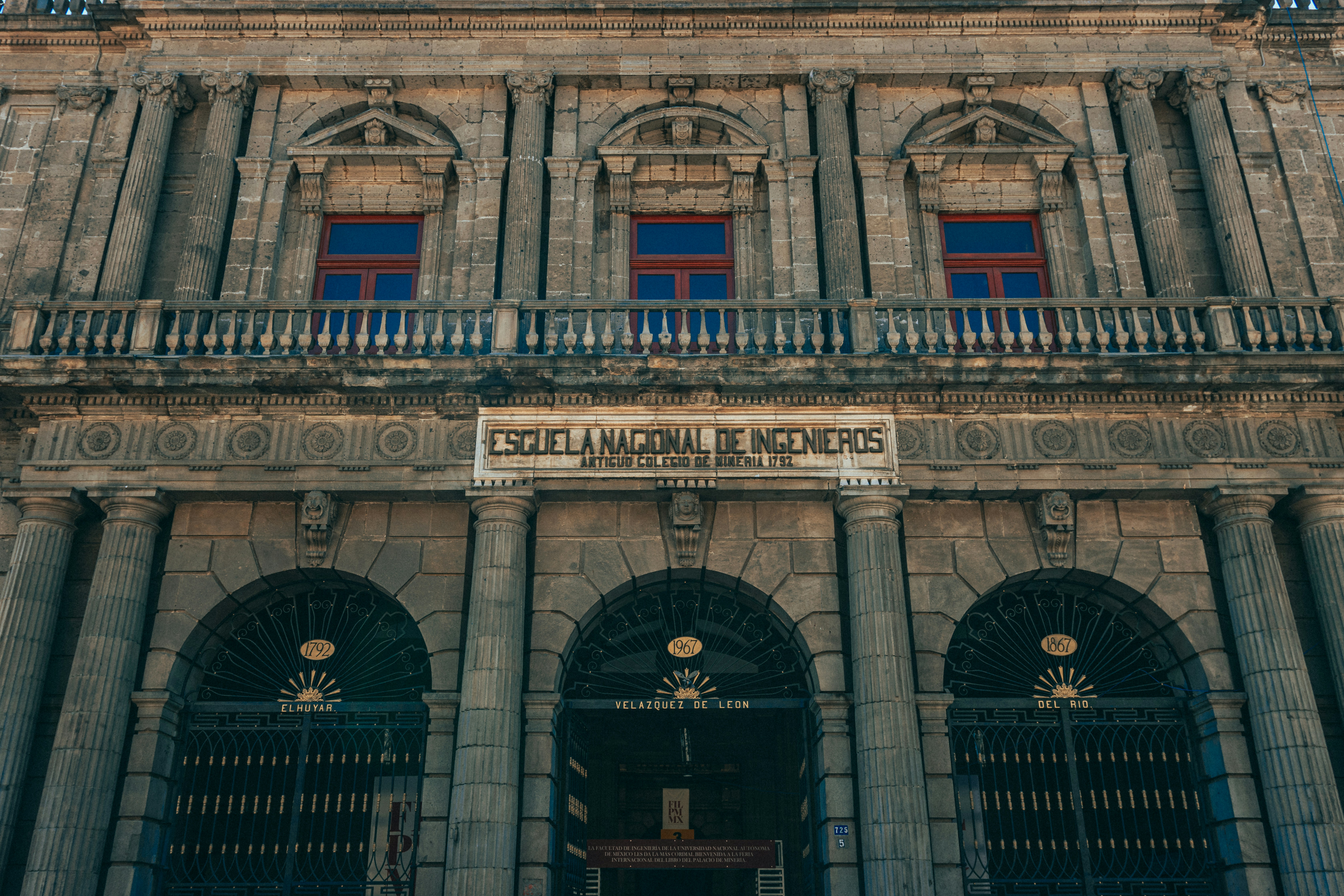 Facade of the Escuela Nacional de Ingenieros: Arched Entries Understone Classroom Windows