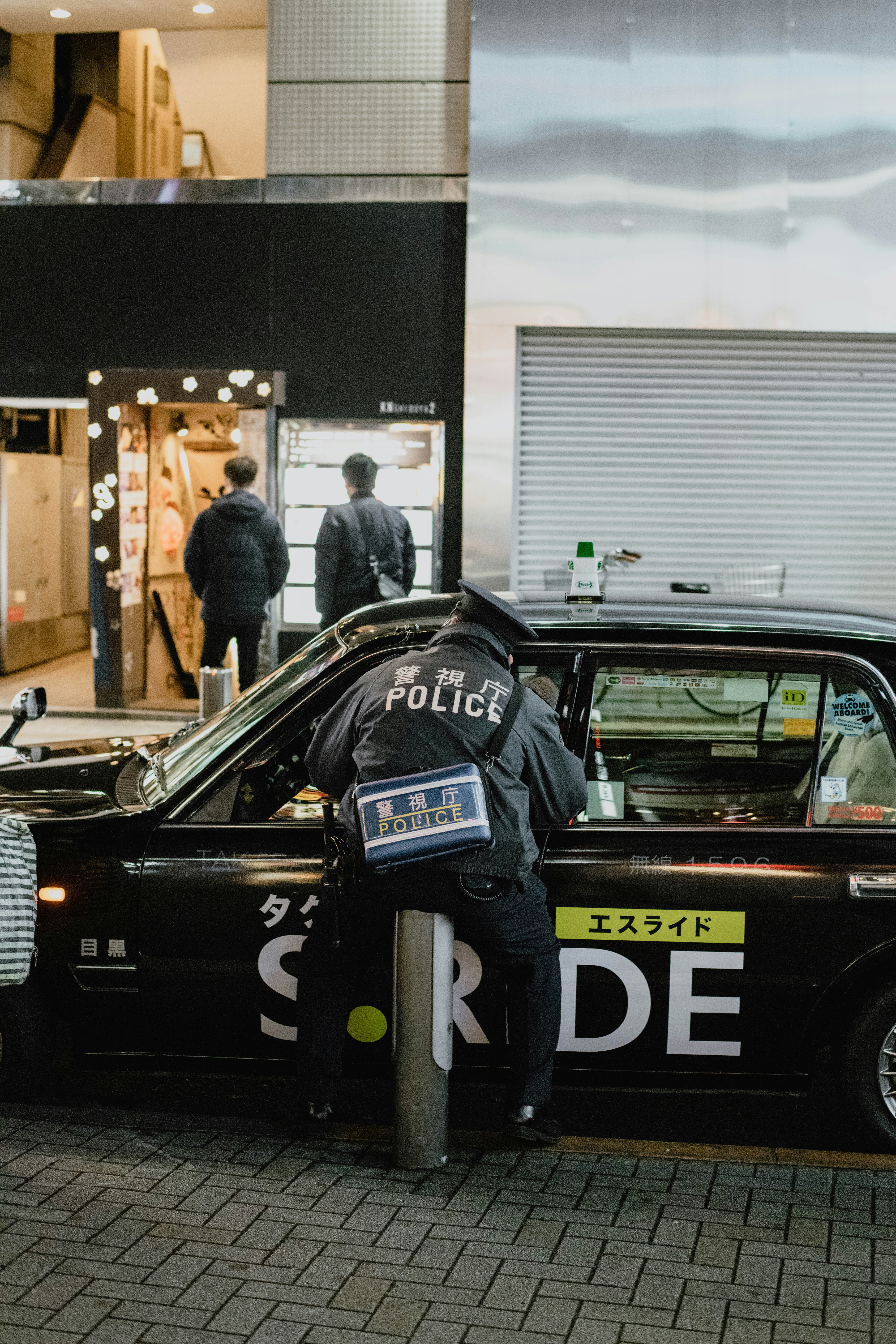 Night Patrol by the Shopfront: A Officer Keeps Watch
