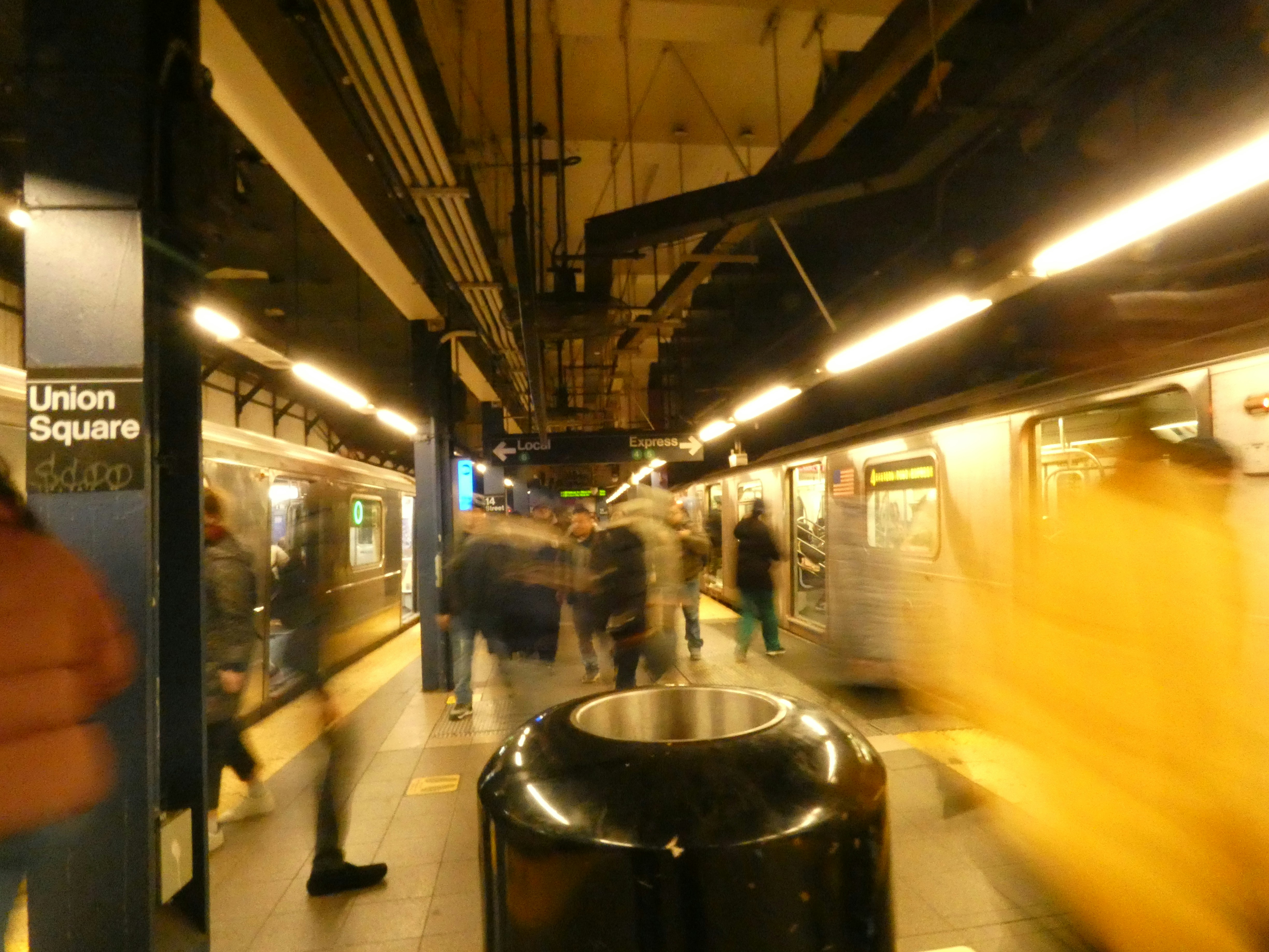 A group of people walking down a subway platform photo – Free 14th ...