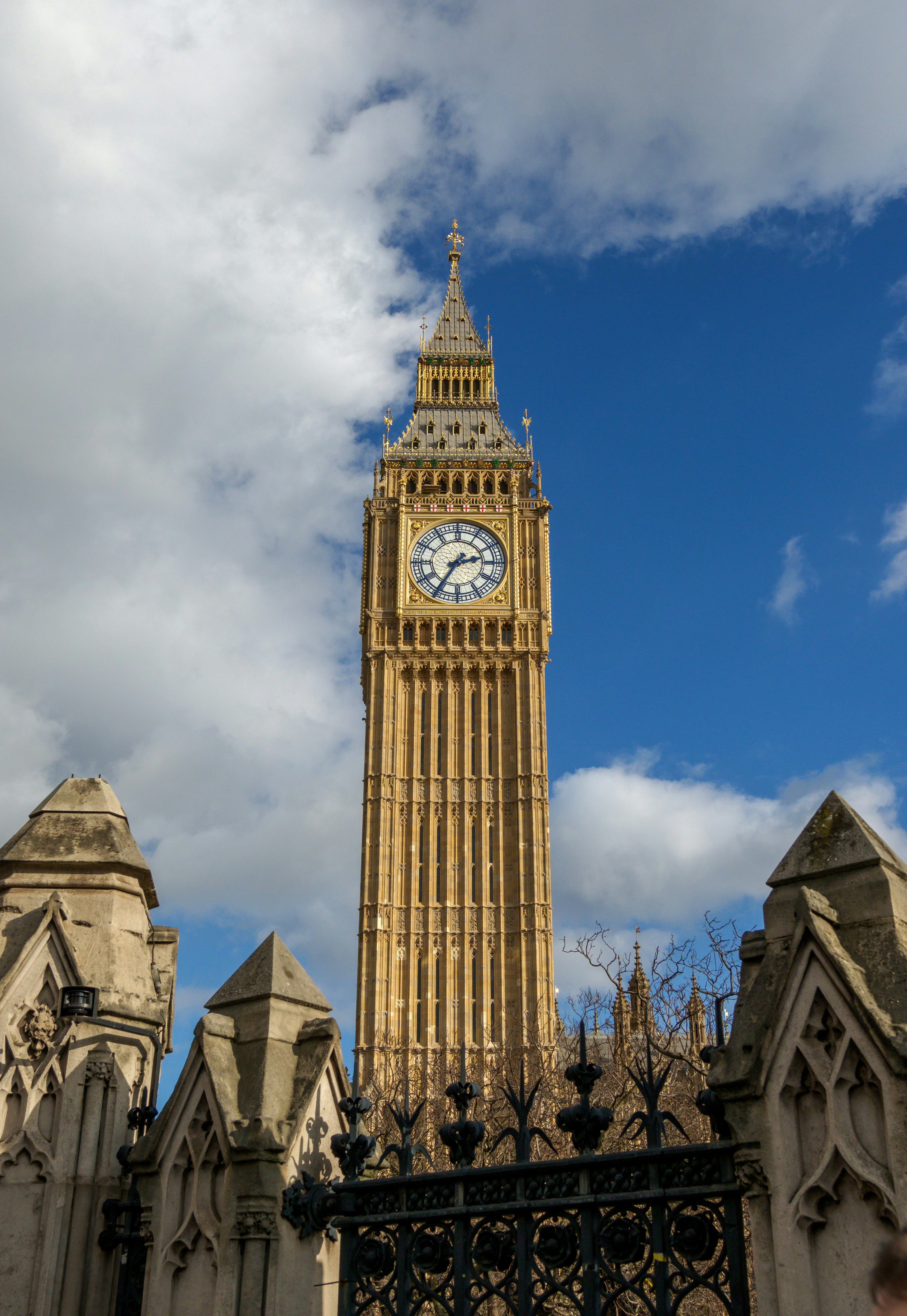 A tall clock tower towering over a city photo – Free Clock tower Image ...