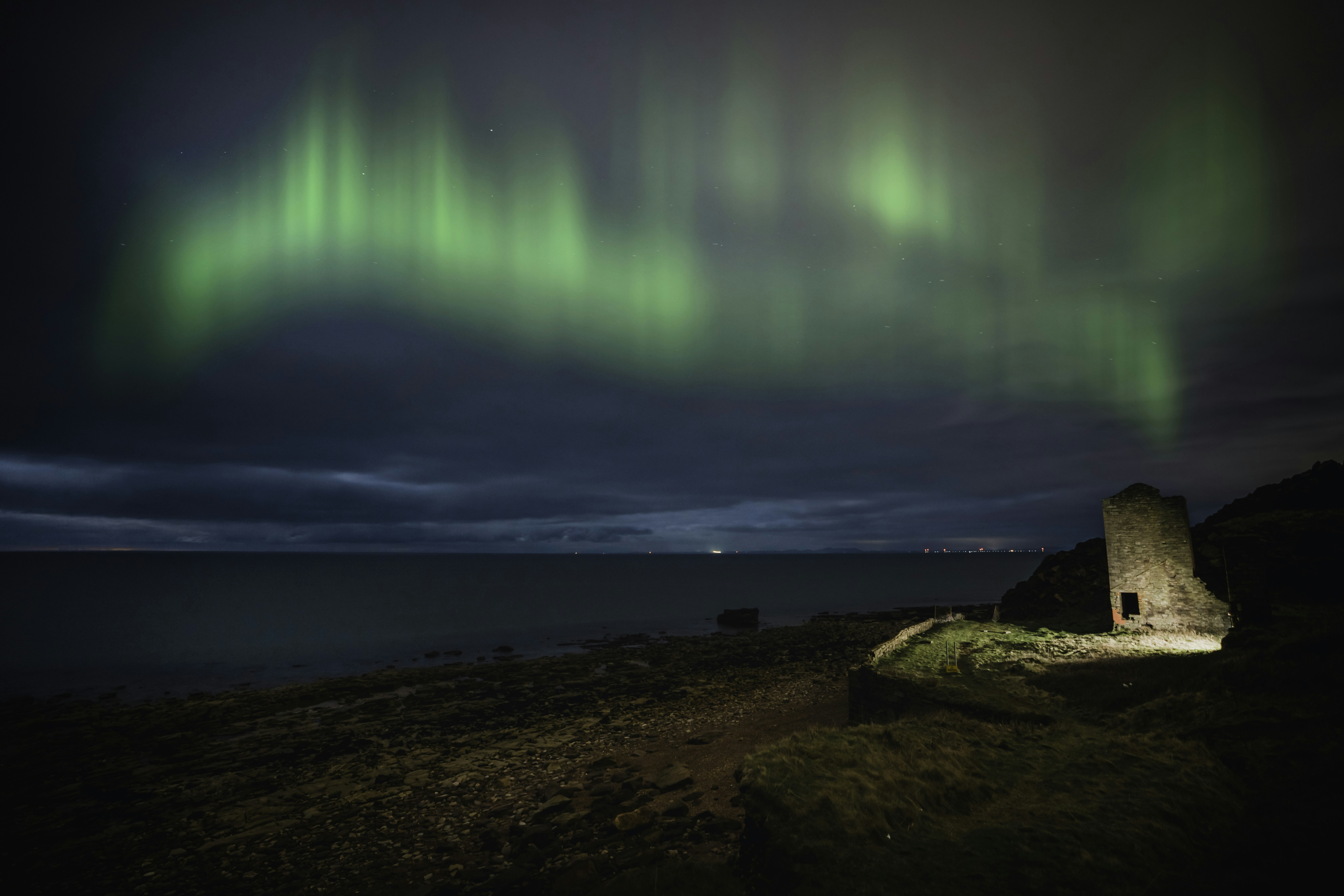 Whispers of the Aurora: A Coastal Ruin's Embrace
