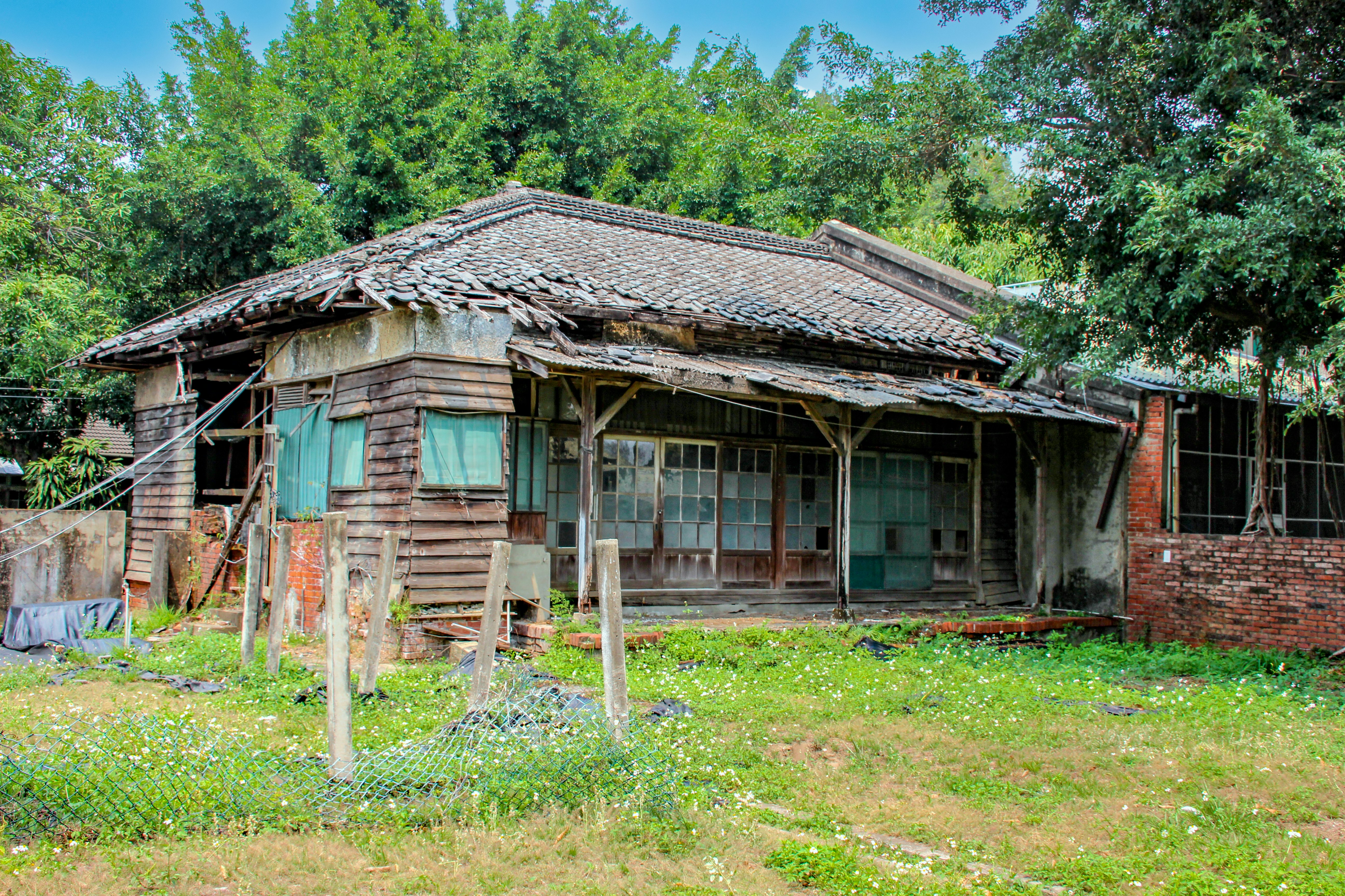 An old run down house with a broken roof photo – Free Green Image on ...