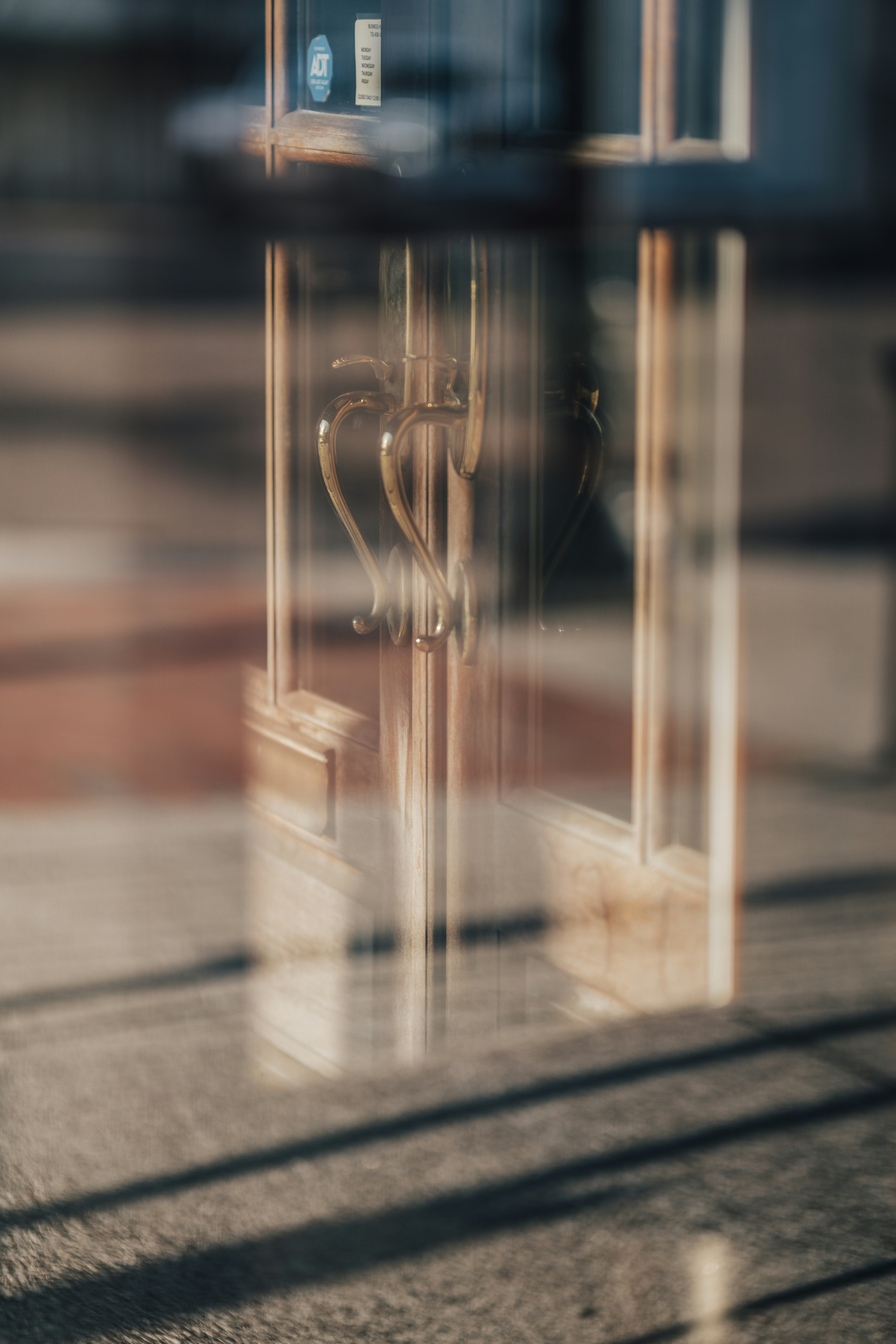 The reflection of a clock in a window photo – Free Floor Image on Unsplash
