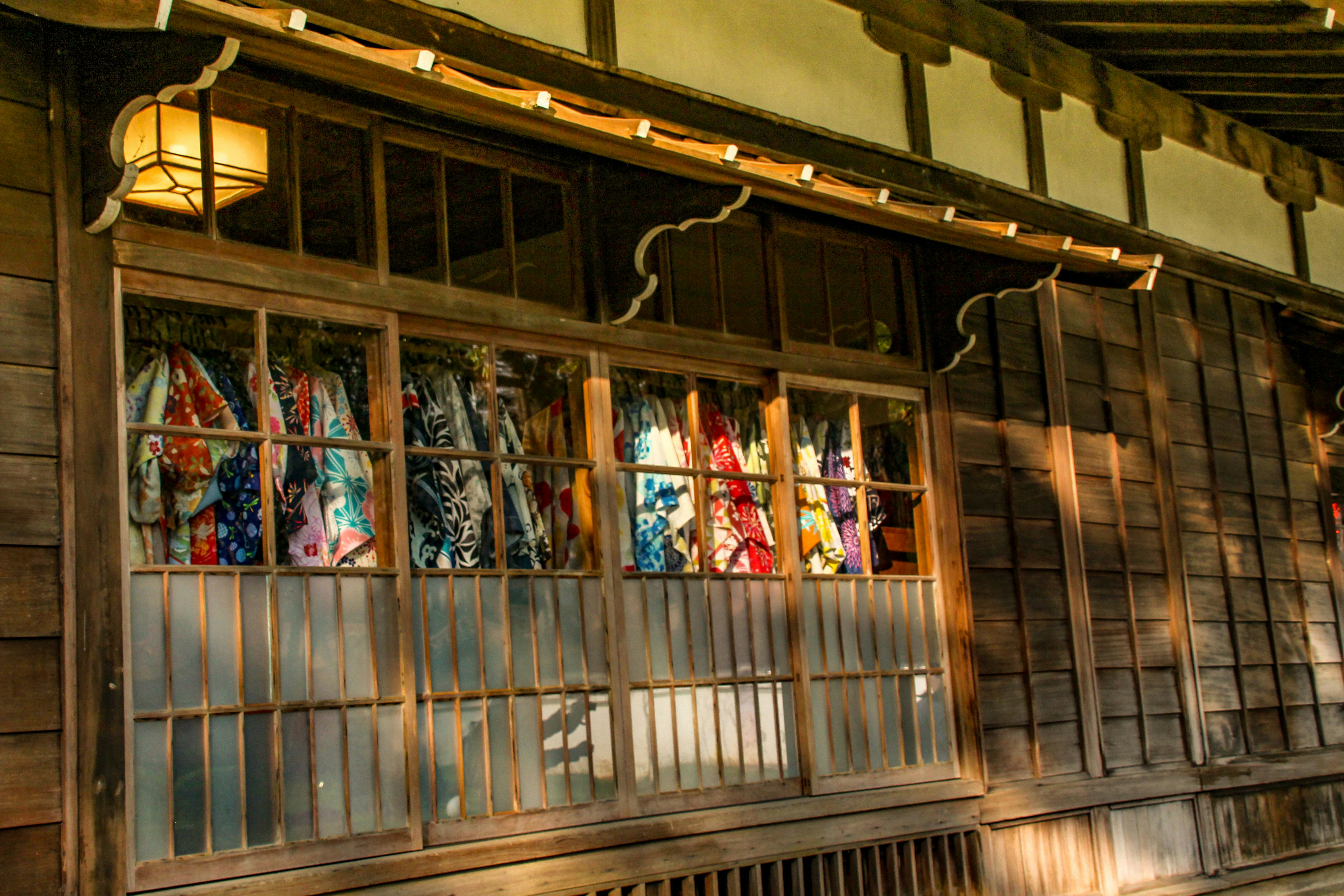 Colorful Panels Behind Weathered Shōji: Light in a Quiet Temple