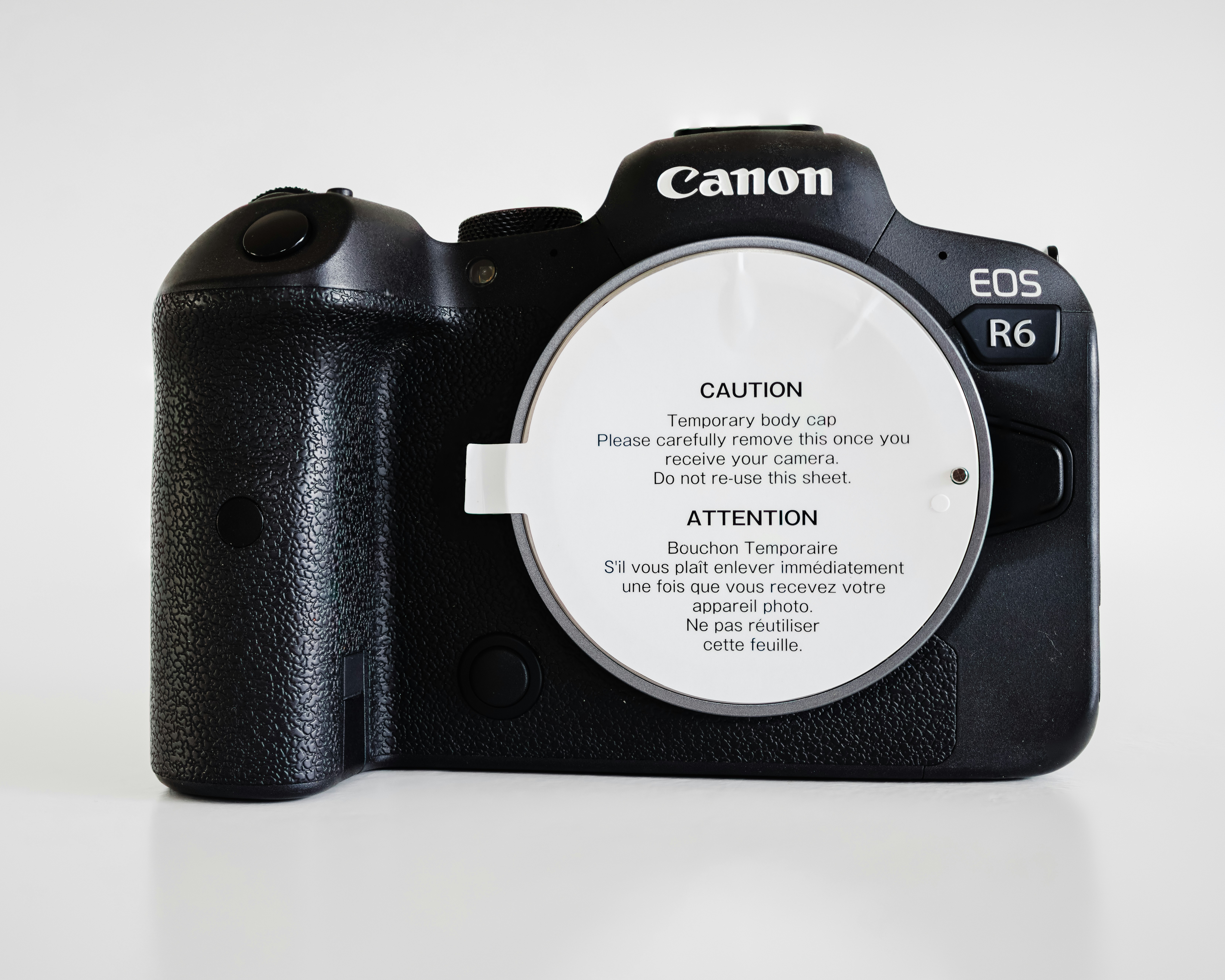 A black camera with a white lens and a white background photo – Free ...