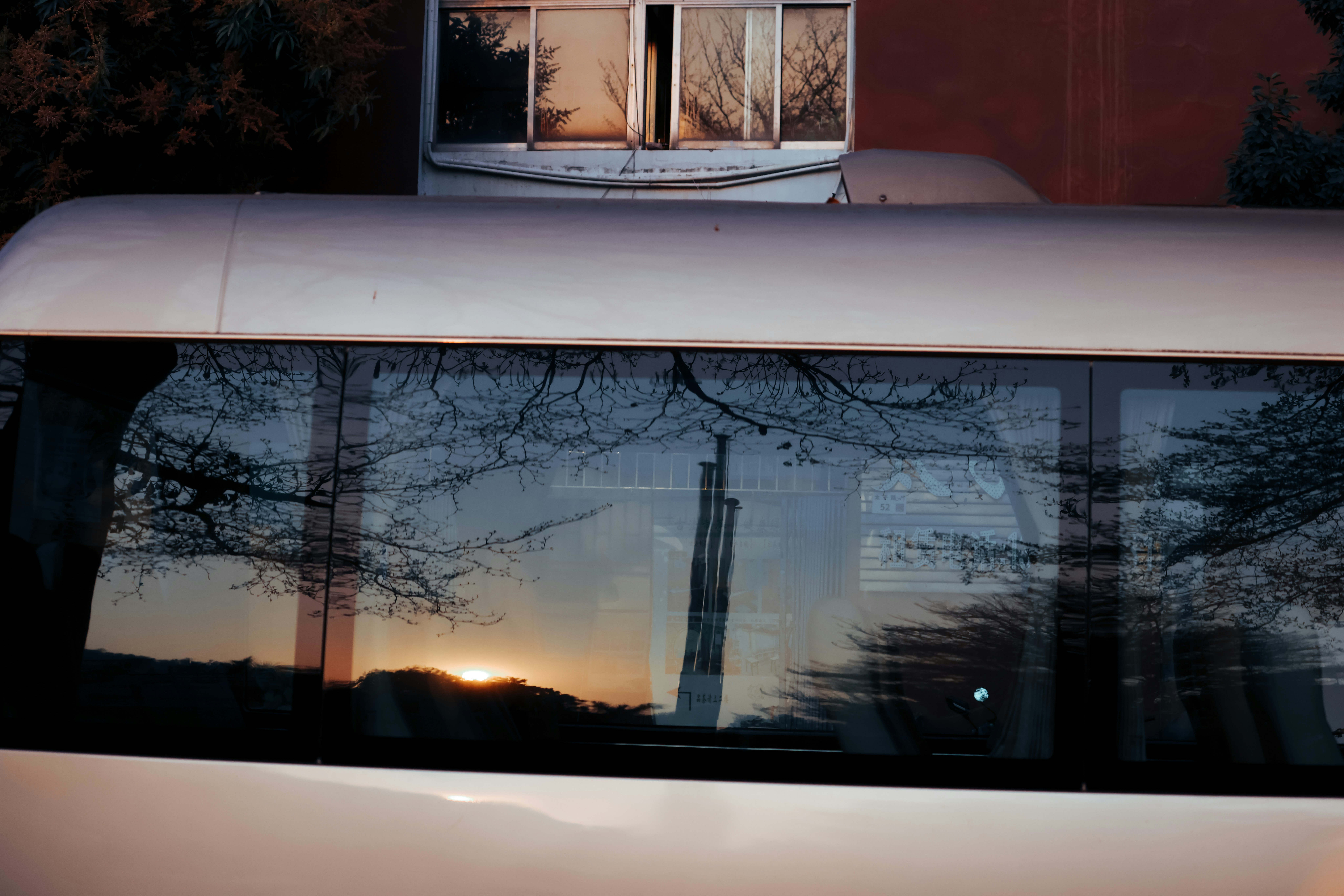 a white car parked in front of a building