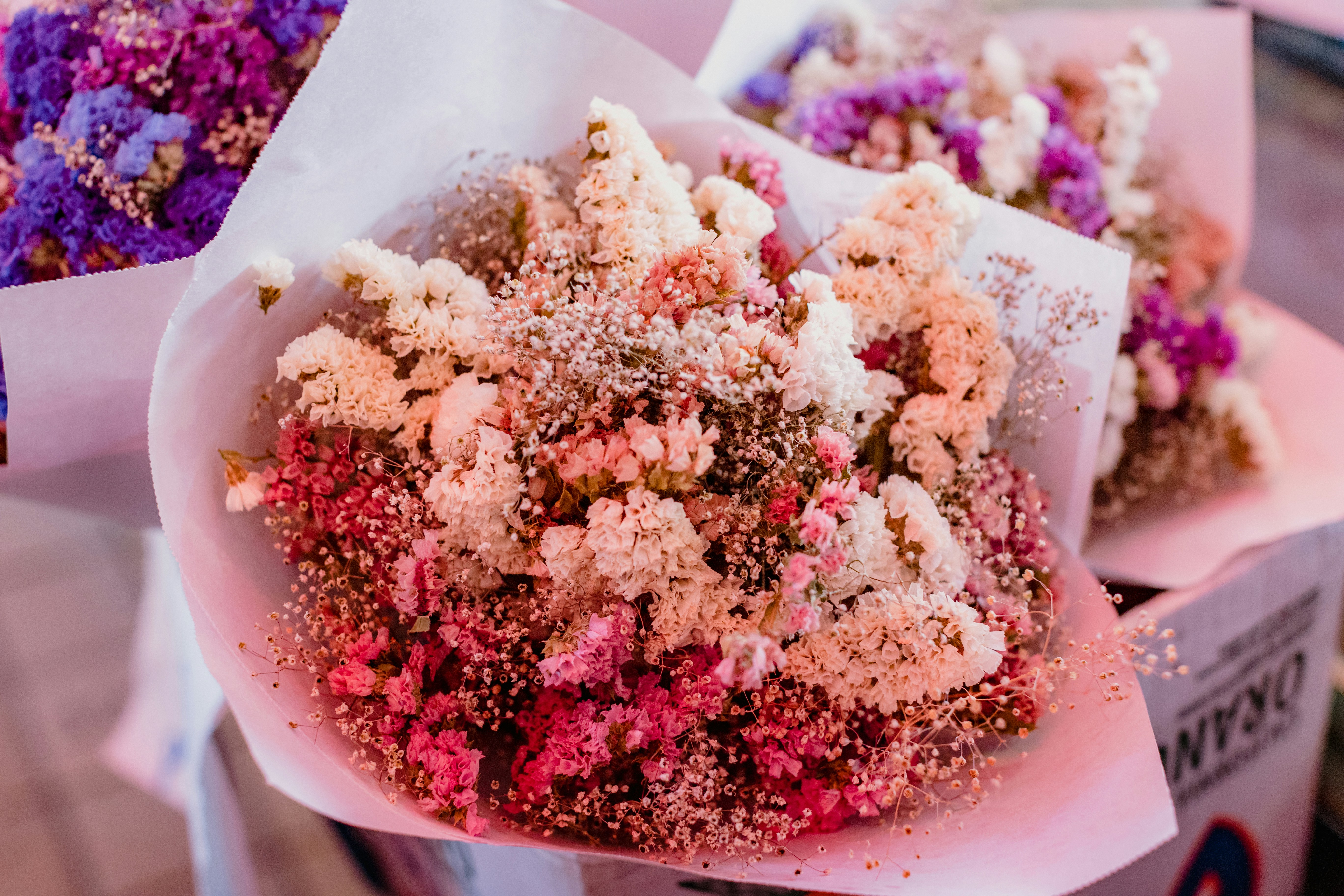 a bunch of flowers that are in some paper