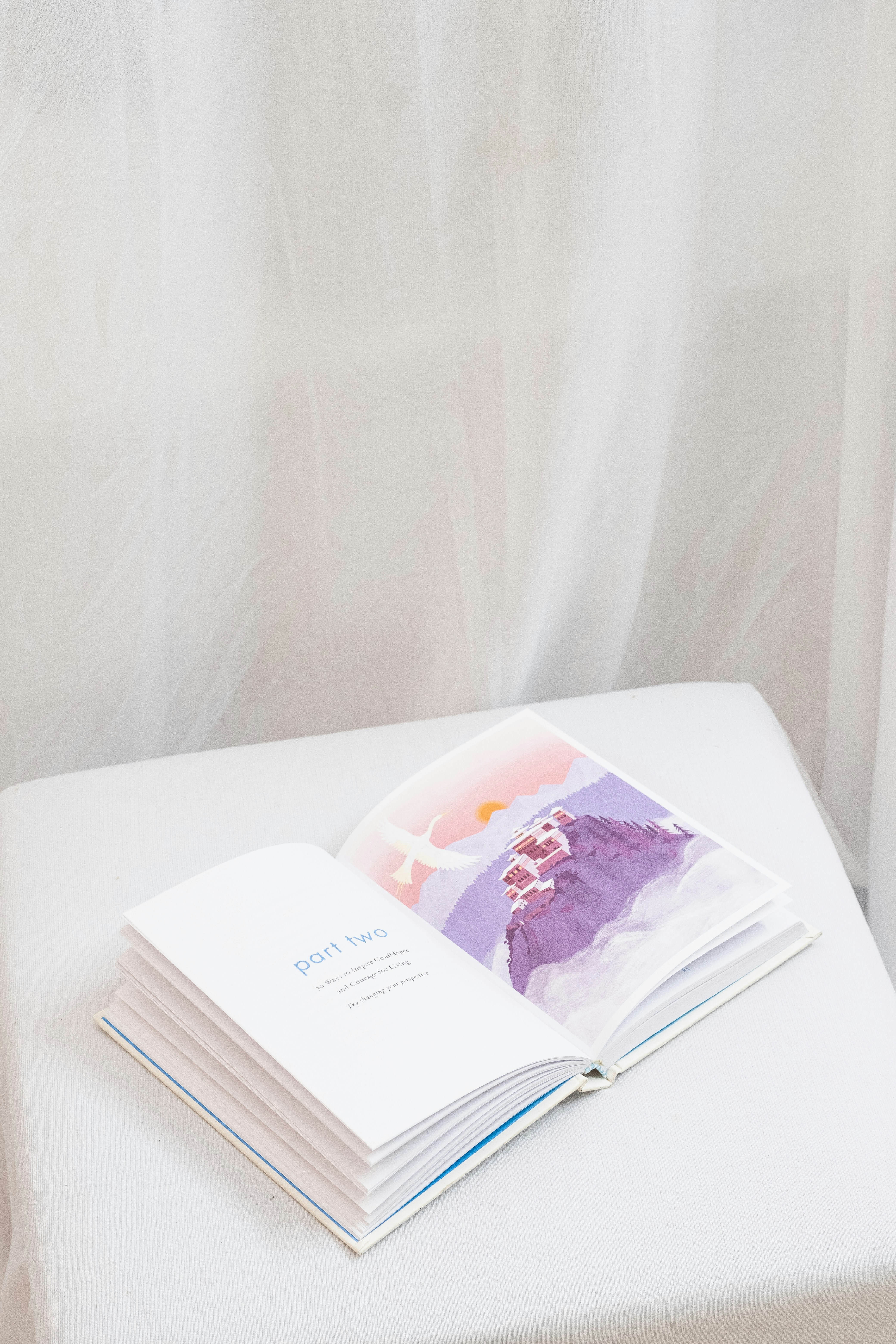A stack of books sitting on top of a white table photo – Free Art Image ...