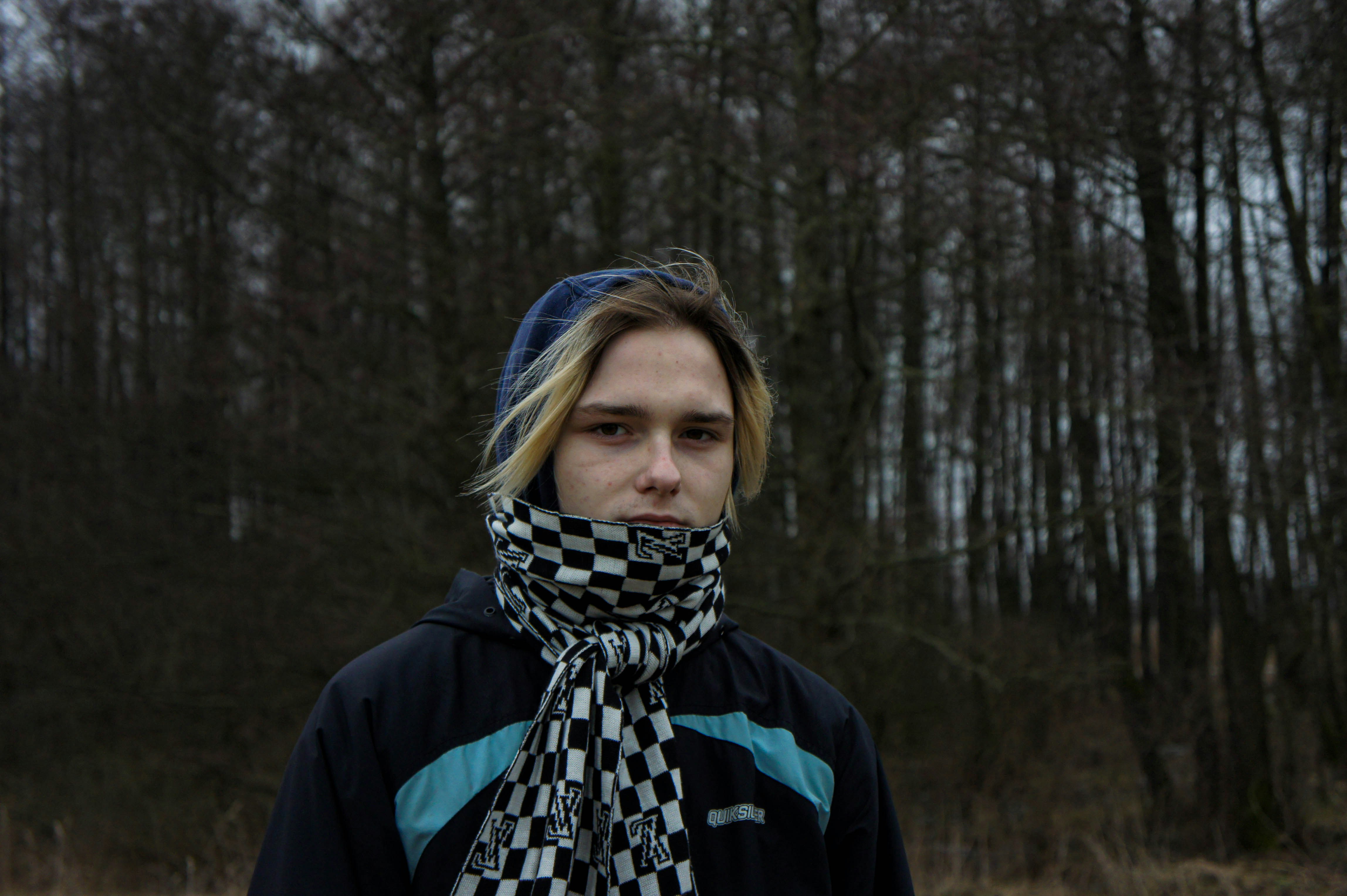 a man with a scarf around his neck