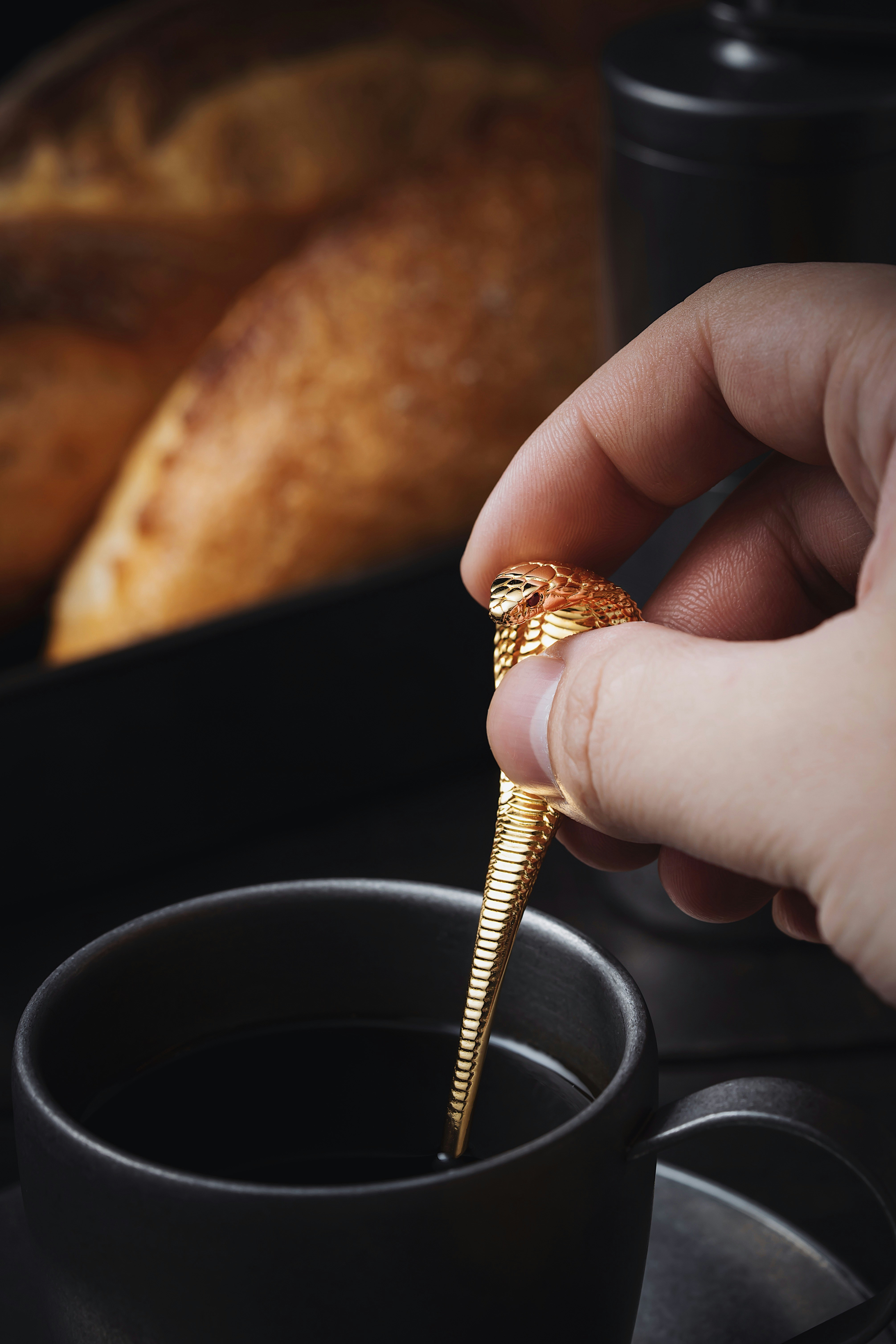 A person is holding a small gold object in their hand photo – Free Food ...