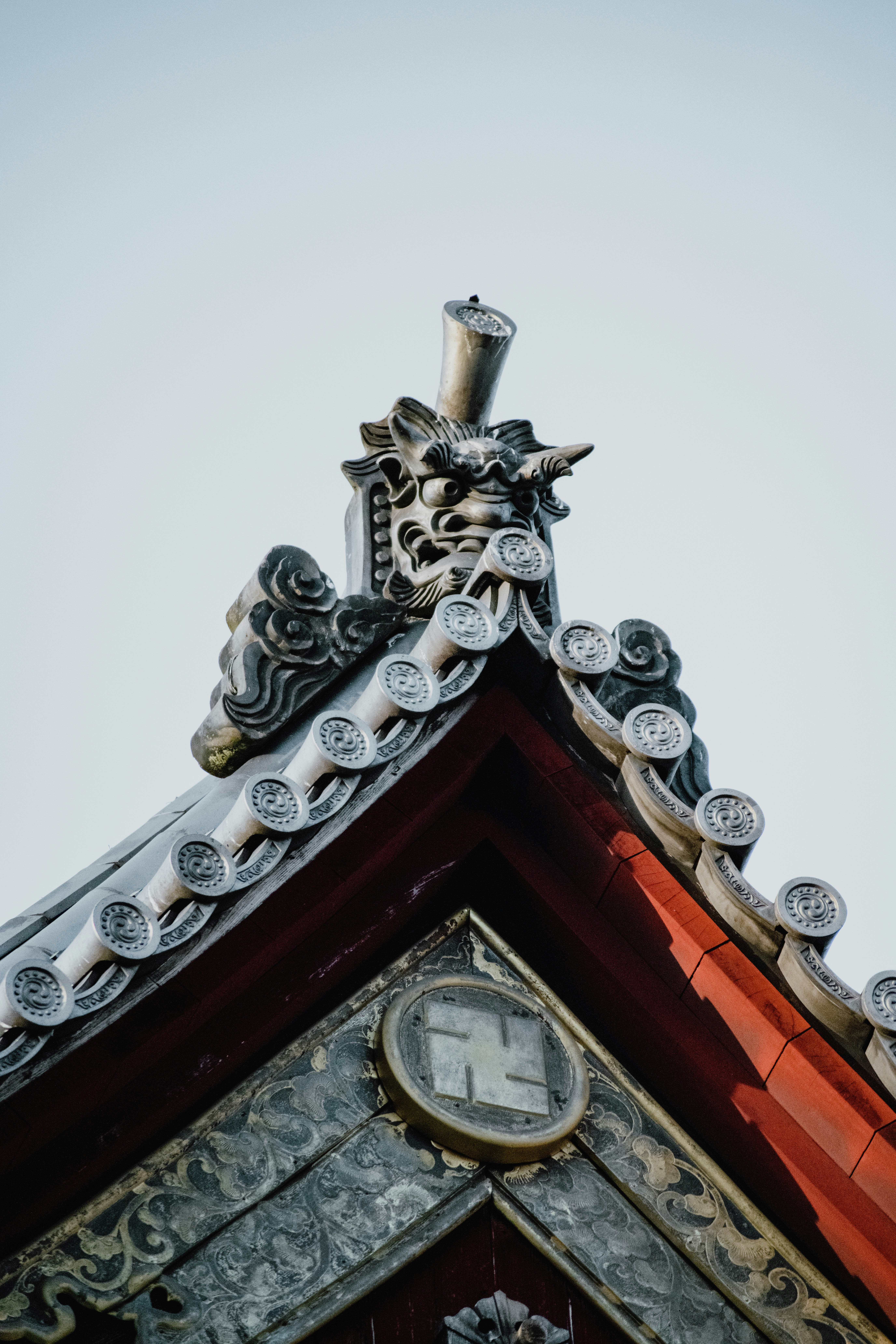 a close up of a roof with a clock on it