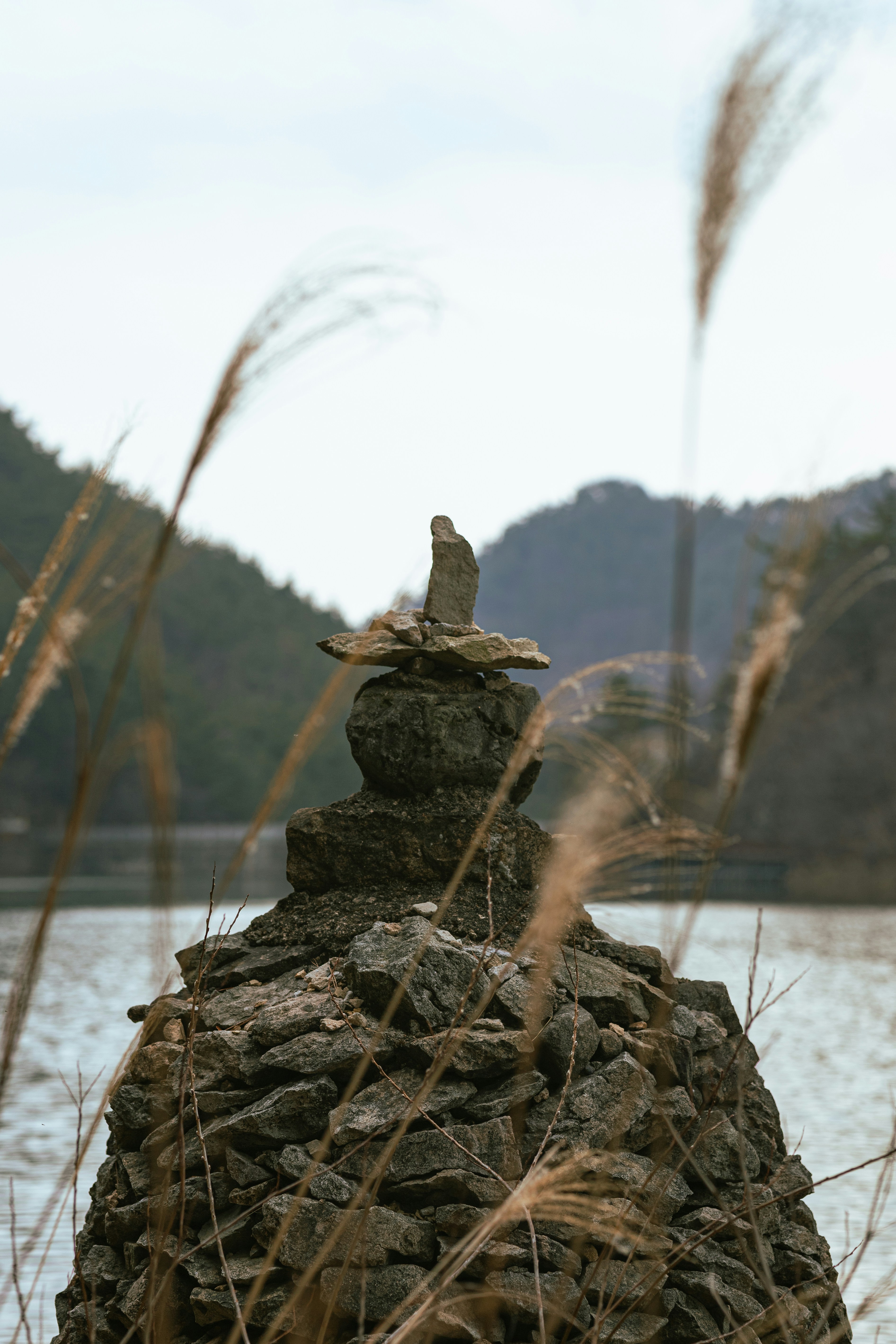 Stone Cairn Sentinel by the Quiet Lake