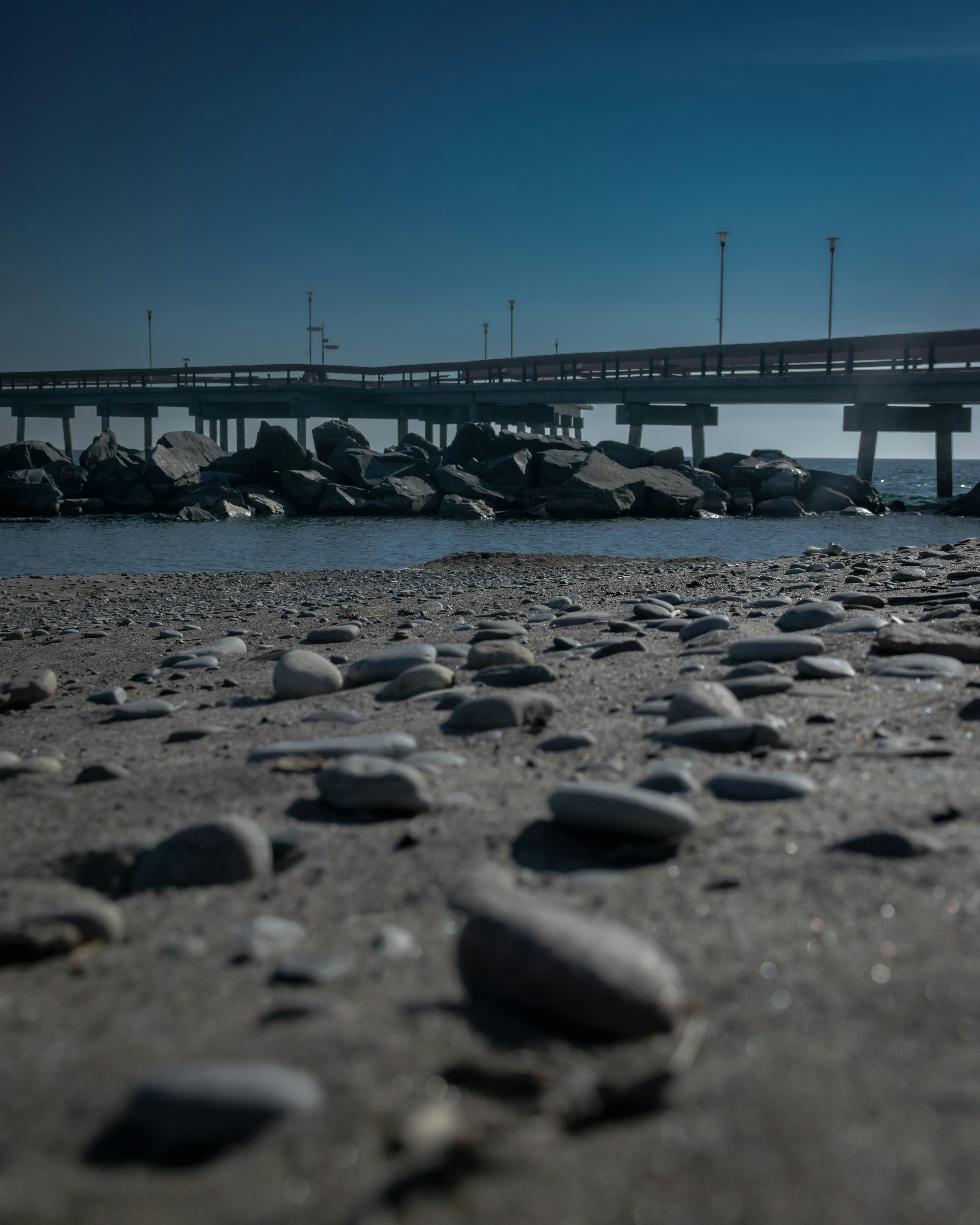 Low angle of pebbles on Toronto Central Island. Feb/23.