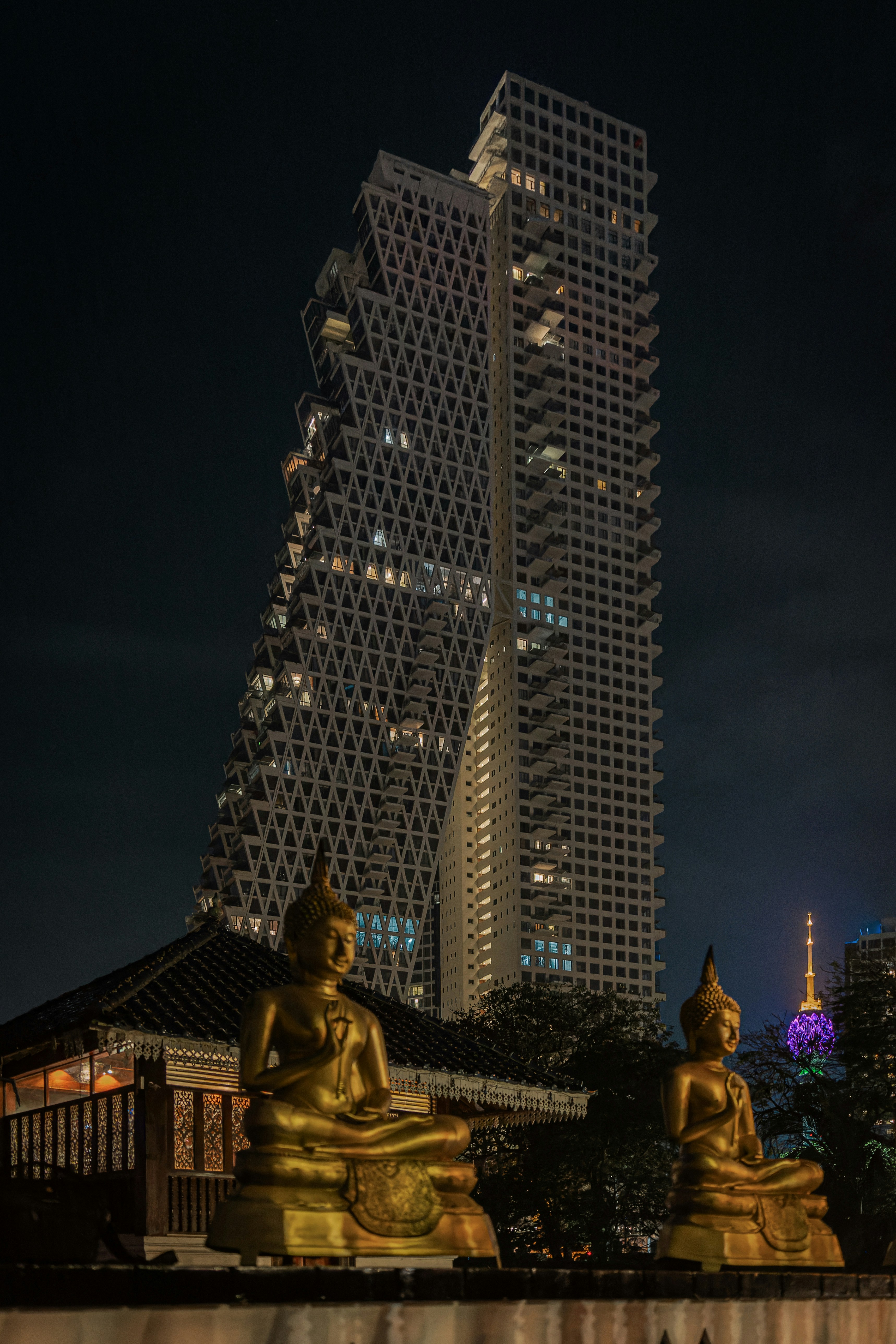A very tall building with some statues in front of it photo – Free ...