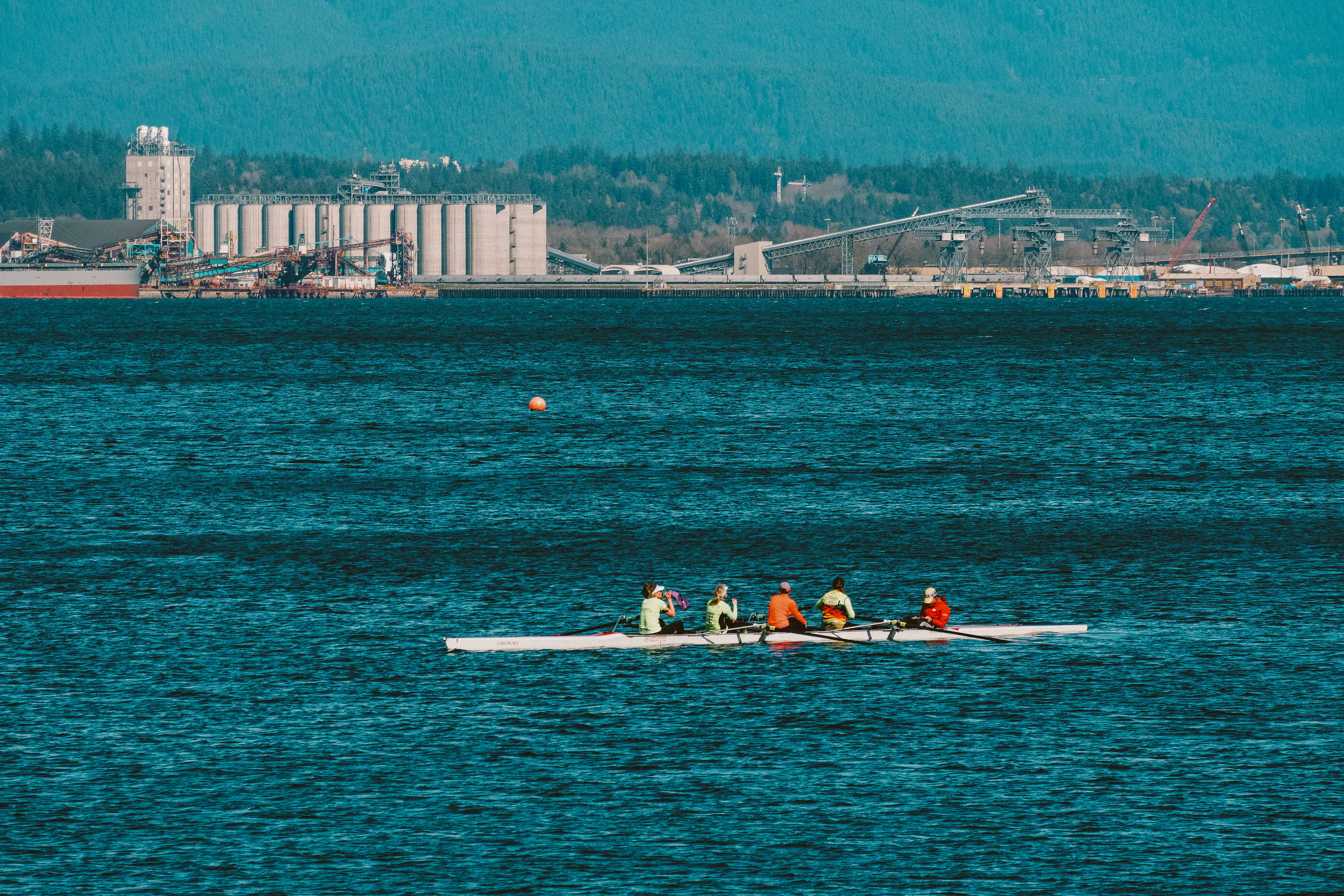 a group of people on a boat in the water