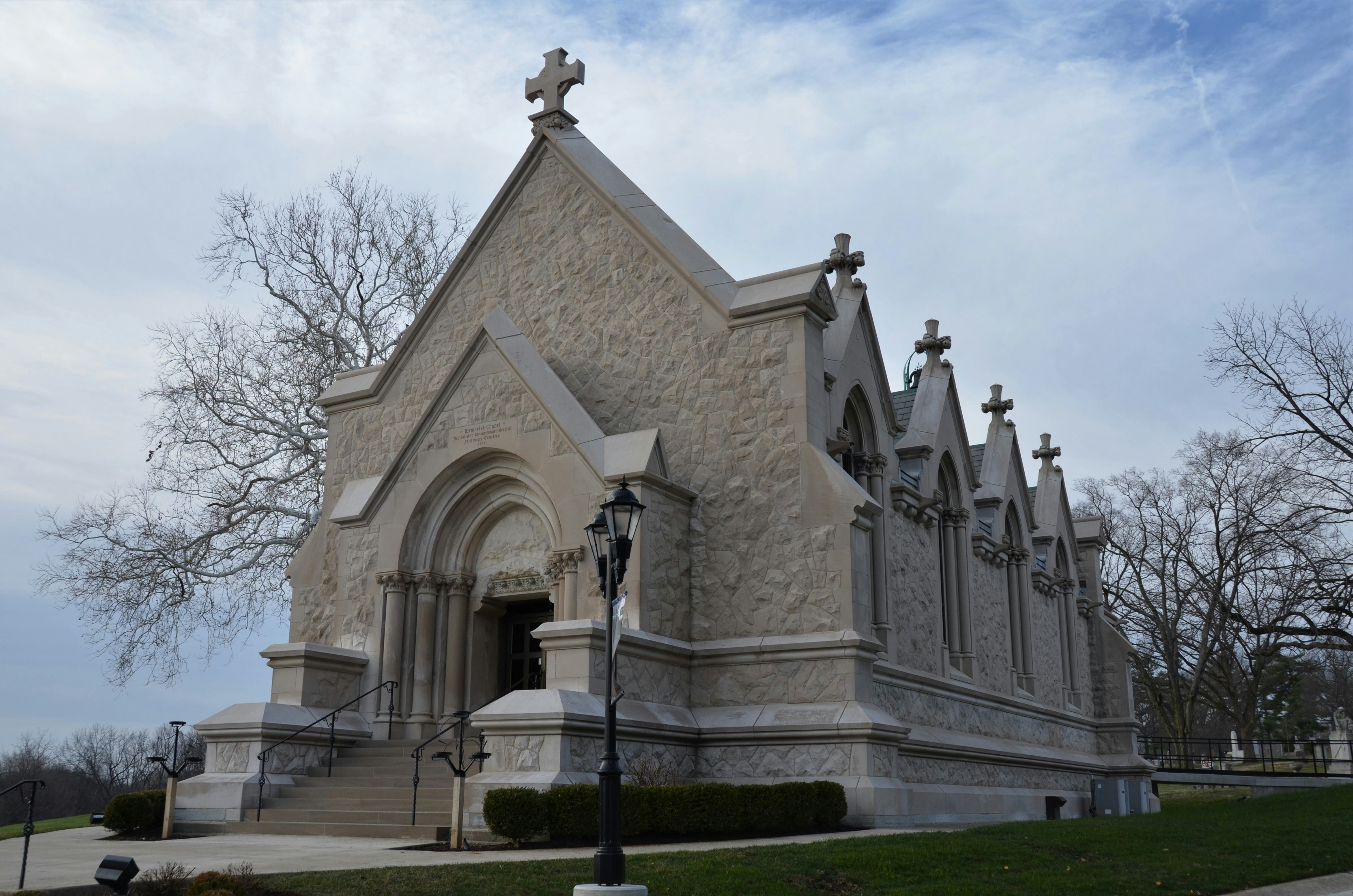 A church with a steeple and a cross on the front photo – Free Building ...
