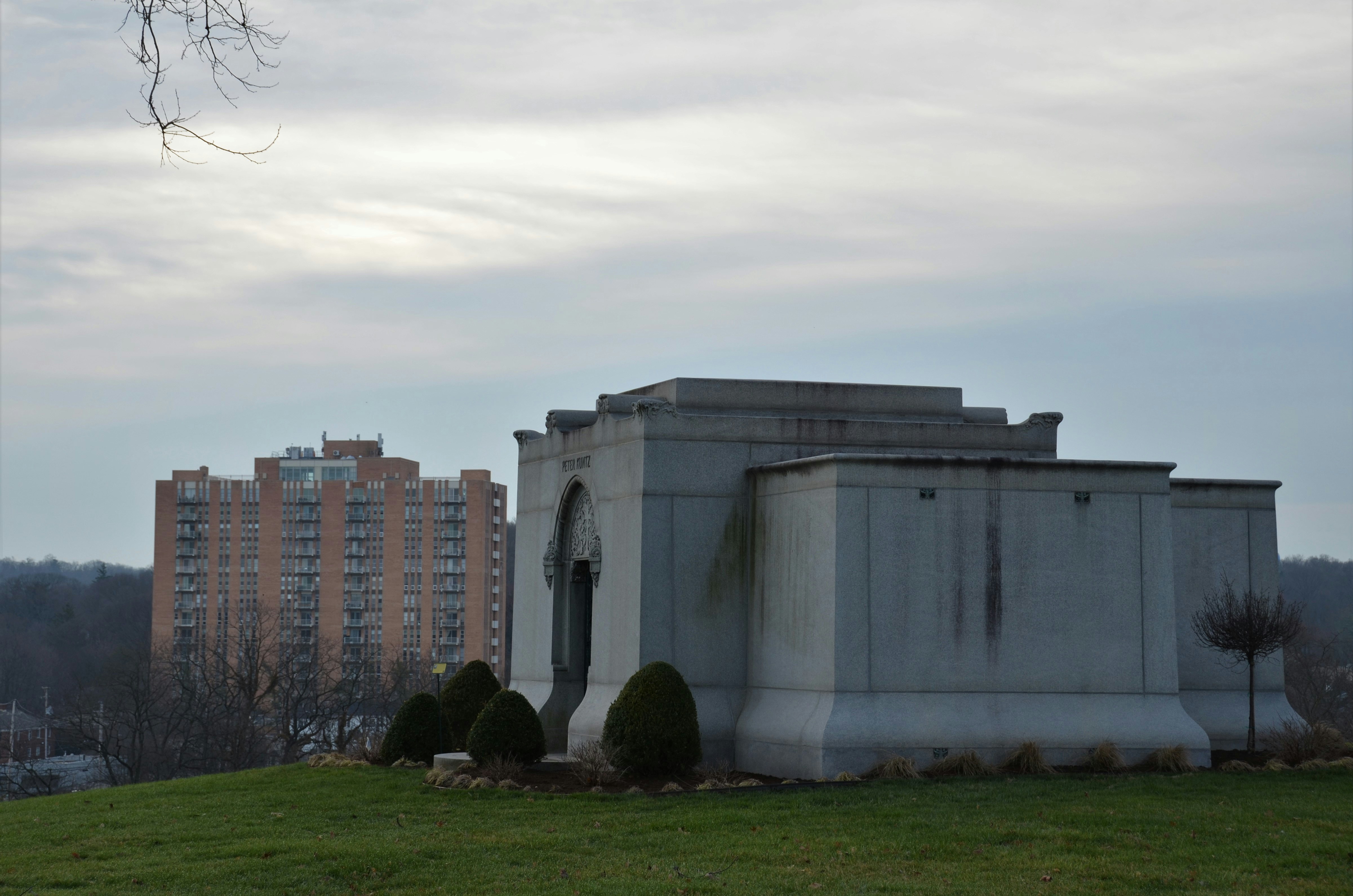 Marble Sentinel at the Edge of Grass and Skyline