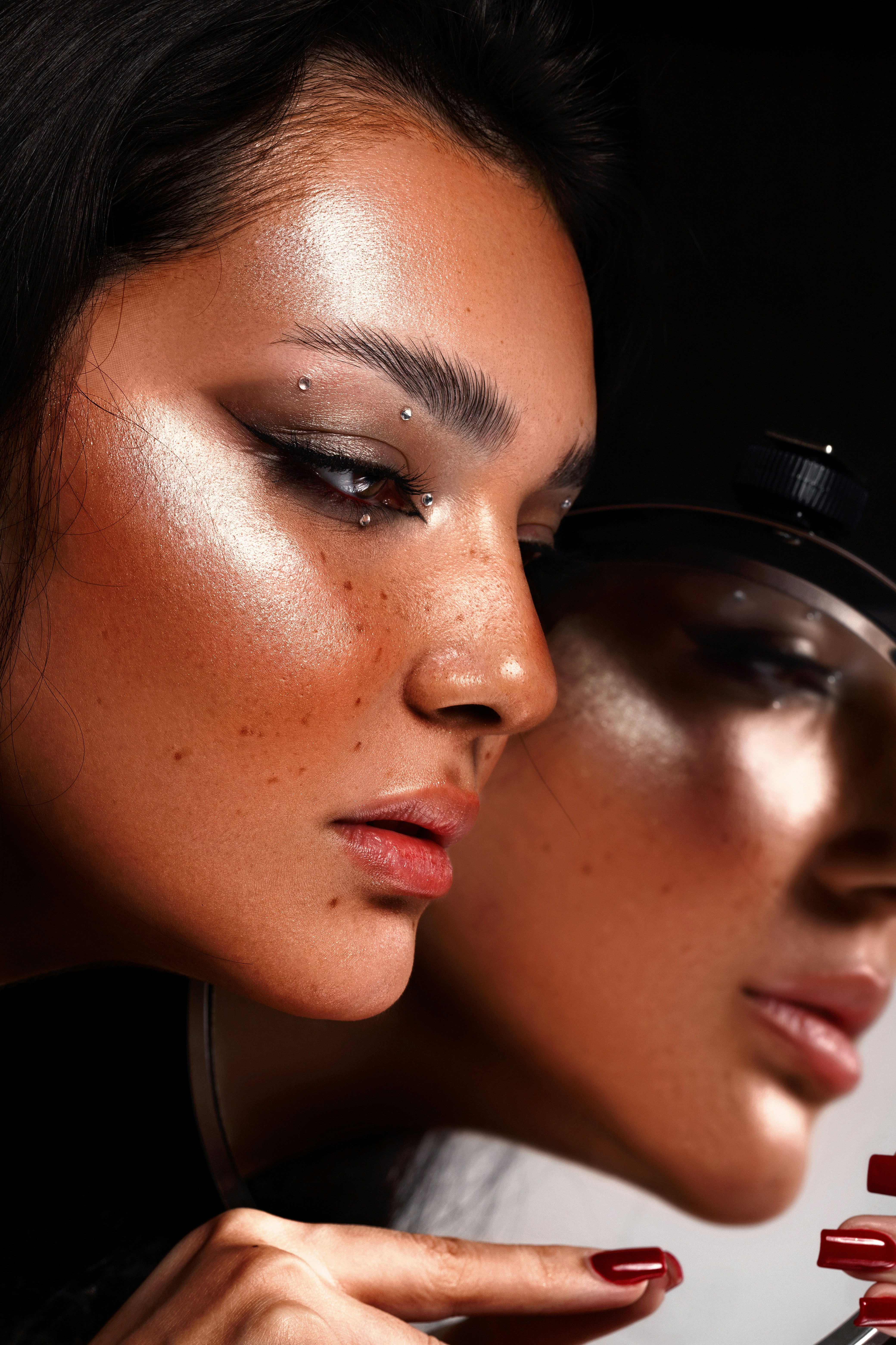 Two beautiful women with makeup and manicures on their faces photo ...