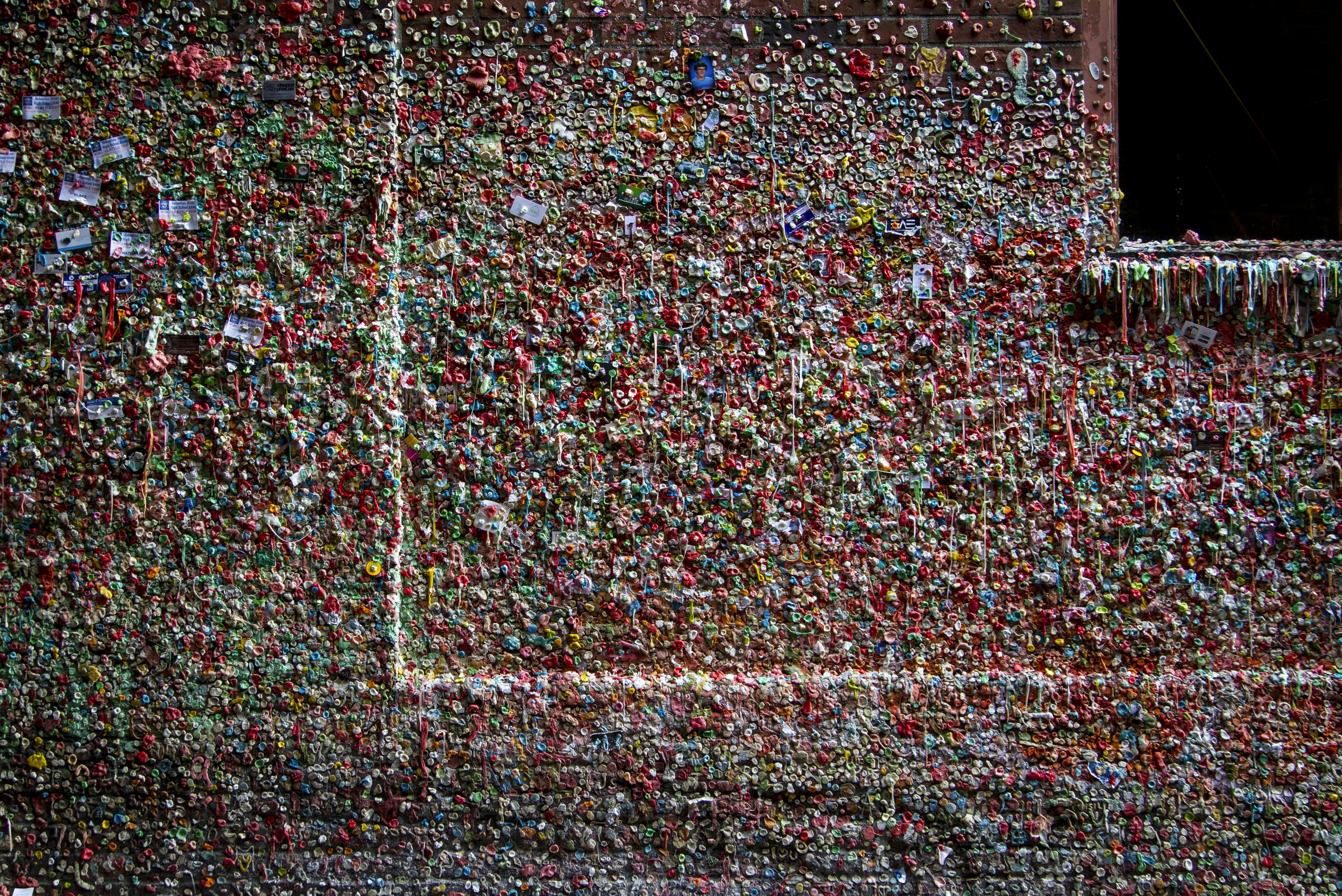 A wall covered in lots of different colored buttons photo – Free Wall ...