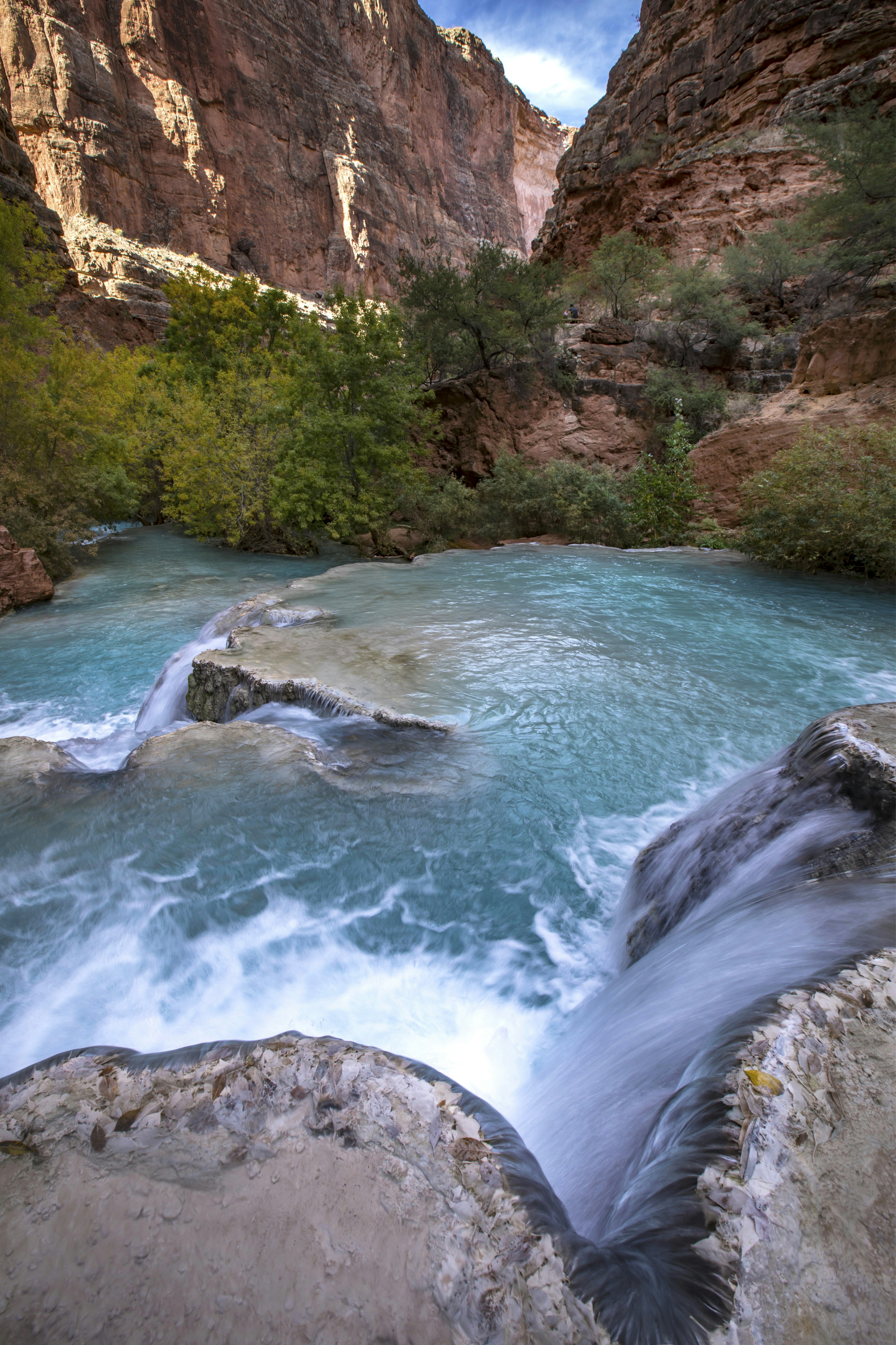 A river running through a canyon surrounded by mountains photo – Free ...