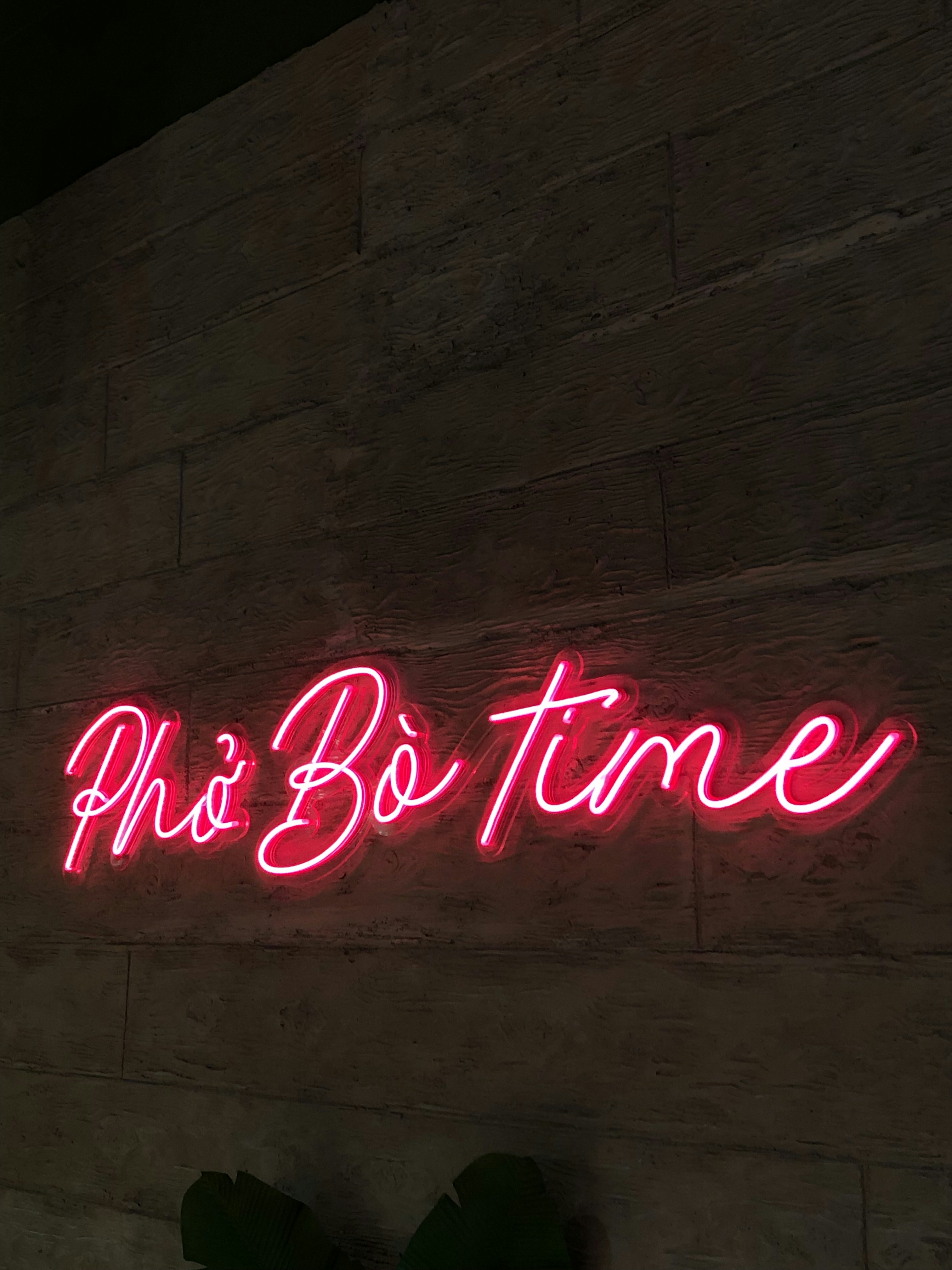 A neon sign that says pho bo time on a wall photo – Free Food Image on ...