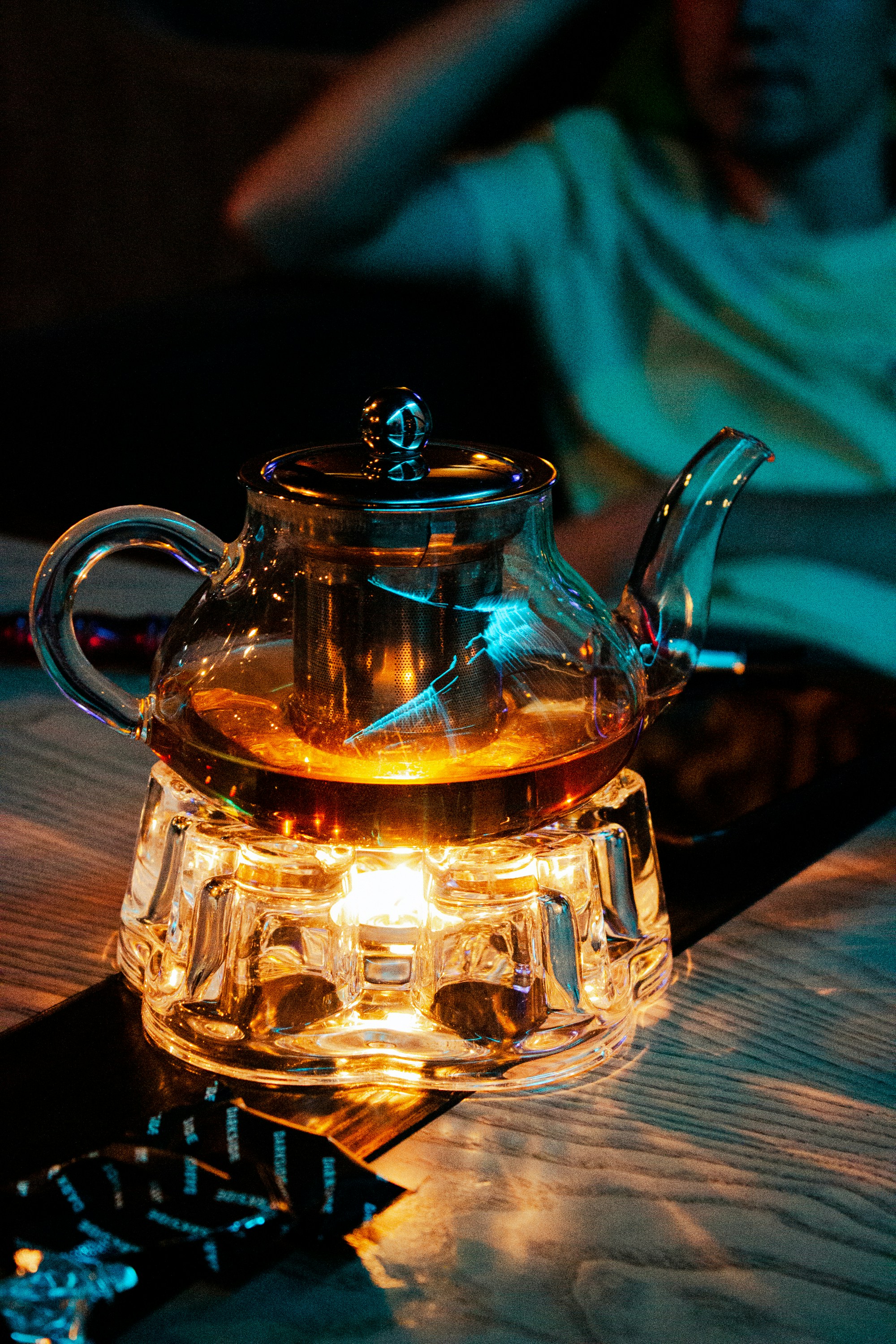 A glass tea pot with a light inside of it photo – Free Teapot Image on ...