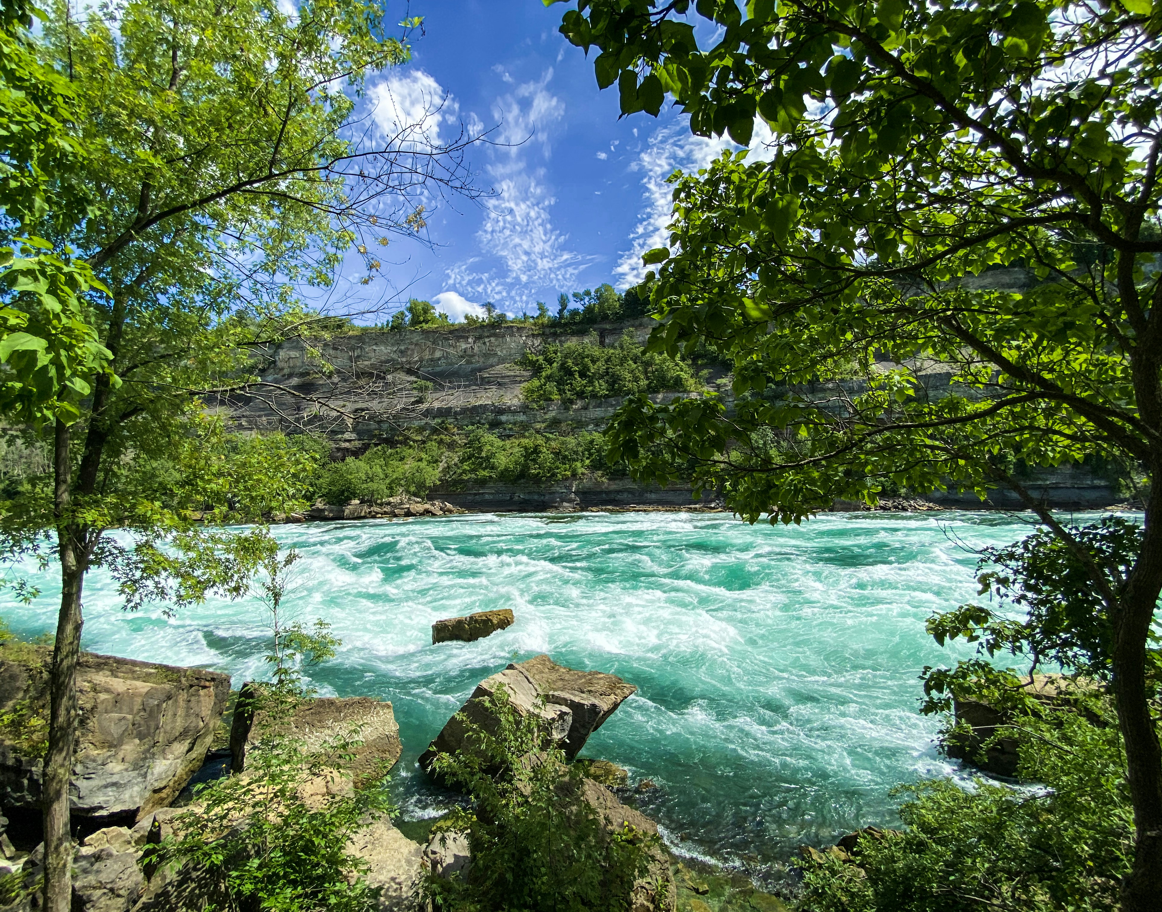 Emerald Rapids Beneath a Clear Sky