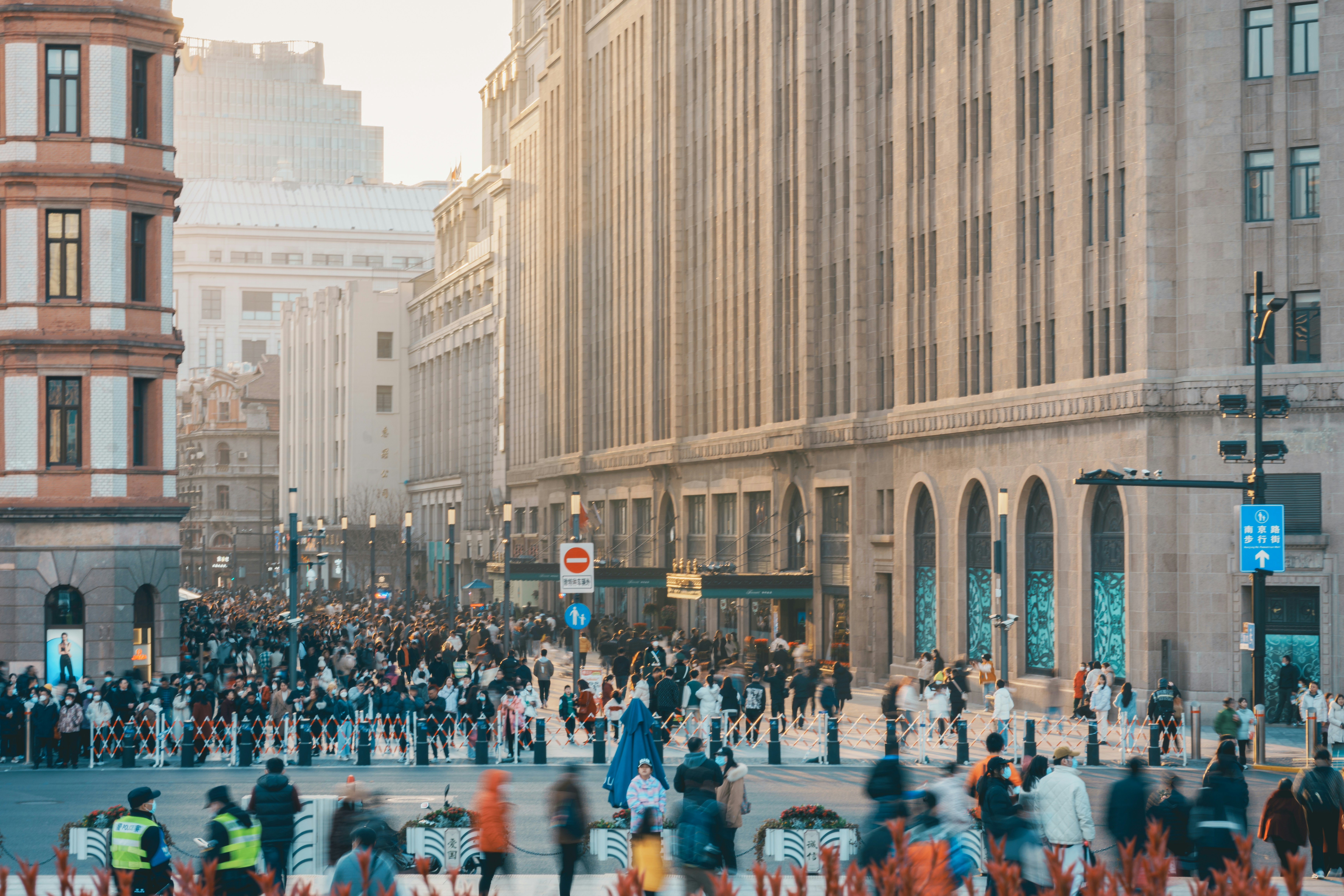 Bustling city street filled with pedestrians and historic architecture, capturing the vibrant energy of urban life.