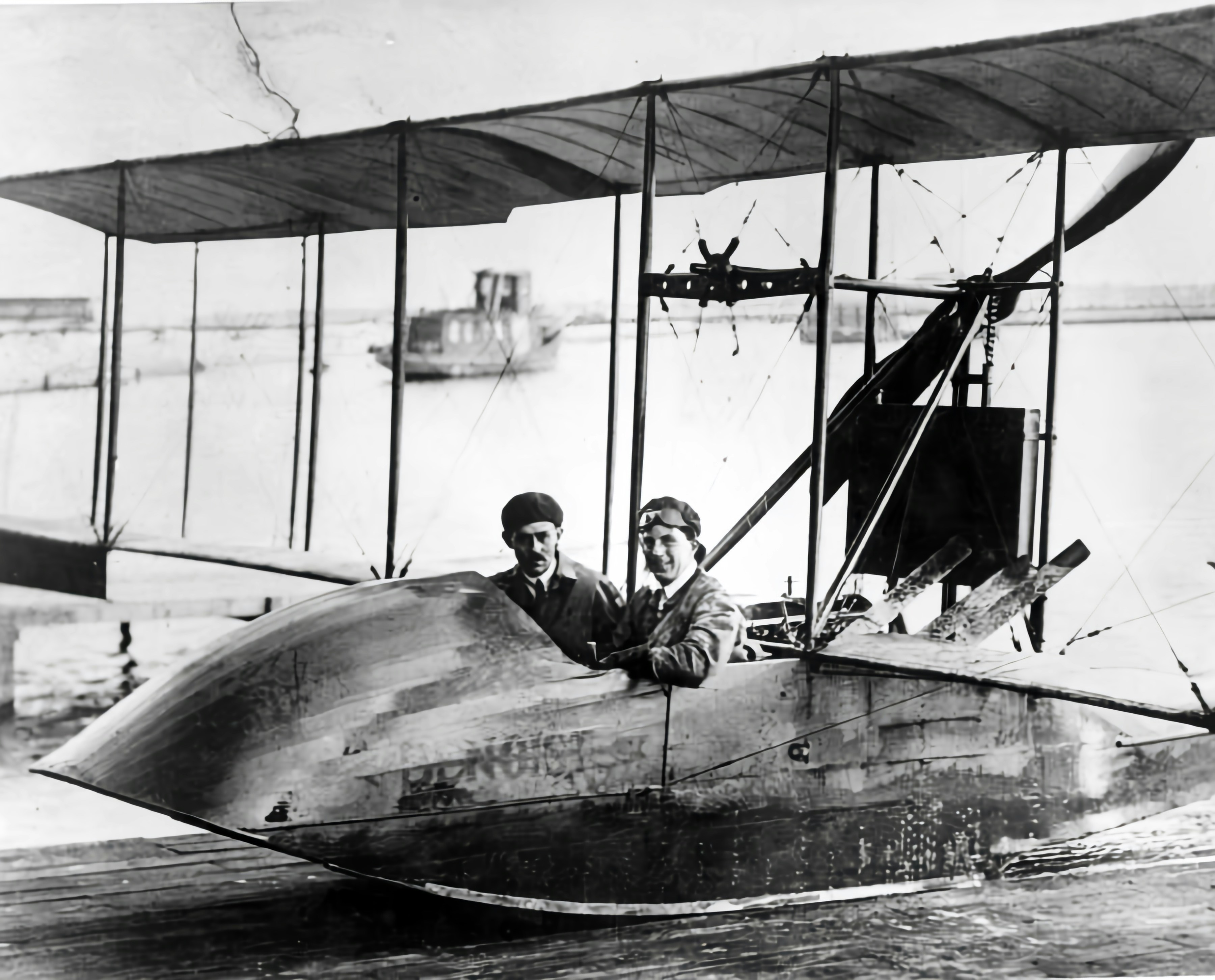 An old photo of two men in a biplane photo – Free Man Image on Unsplash
