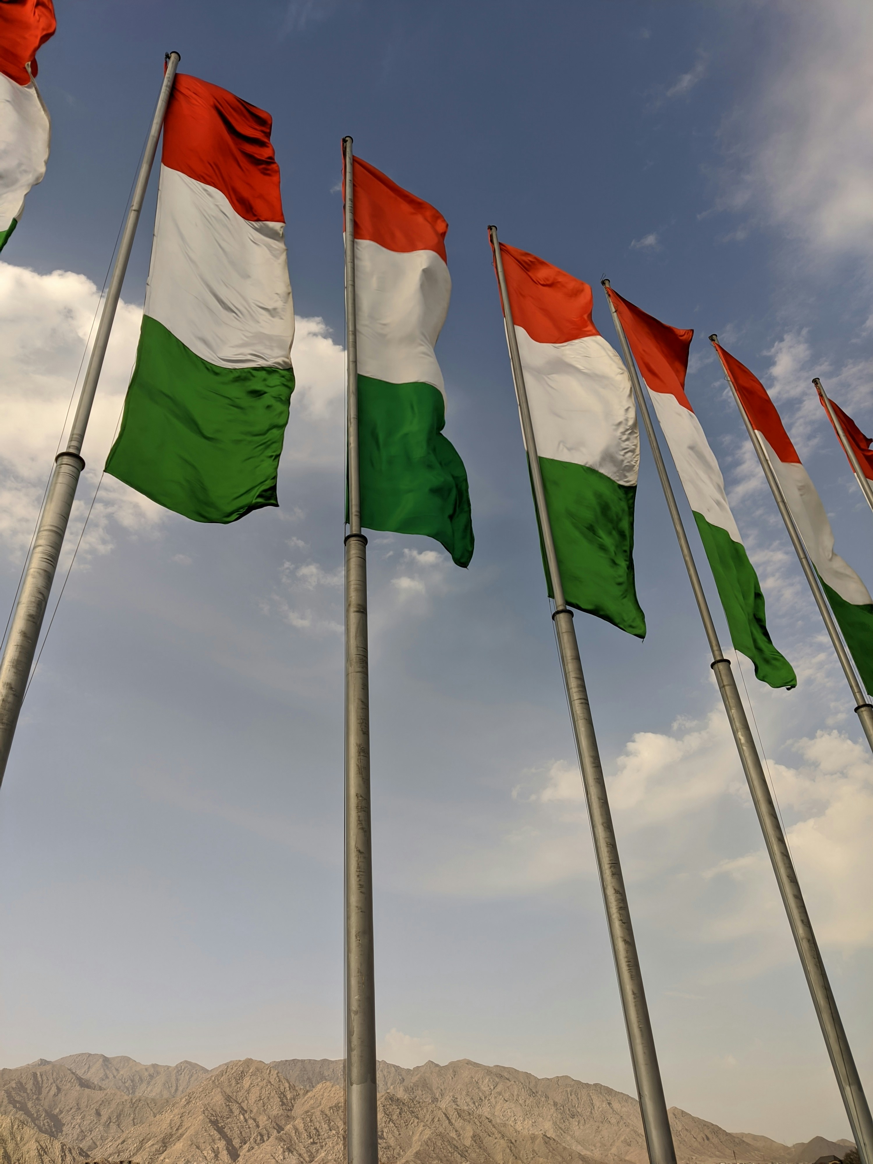 A bunch of flags that are flying in the air photo – Free Khujand Image ...