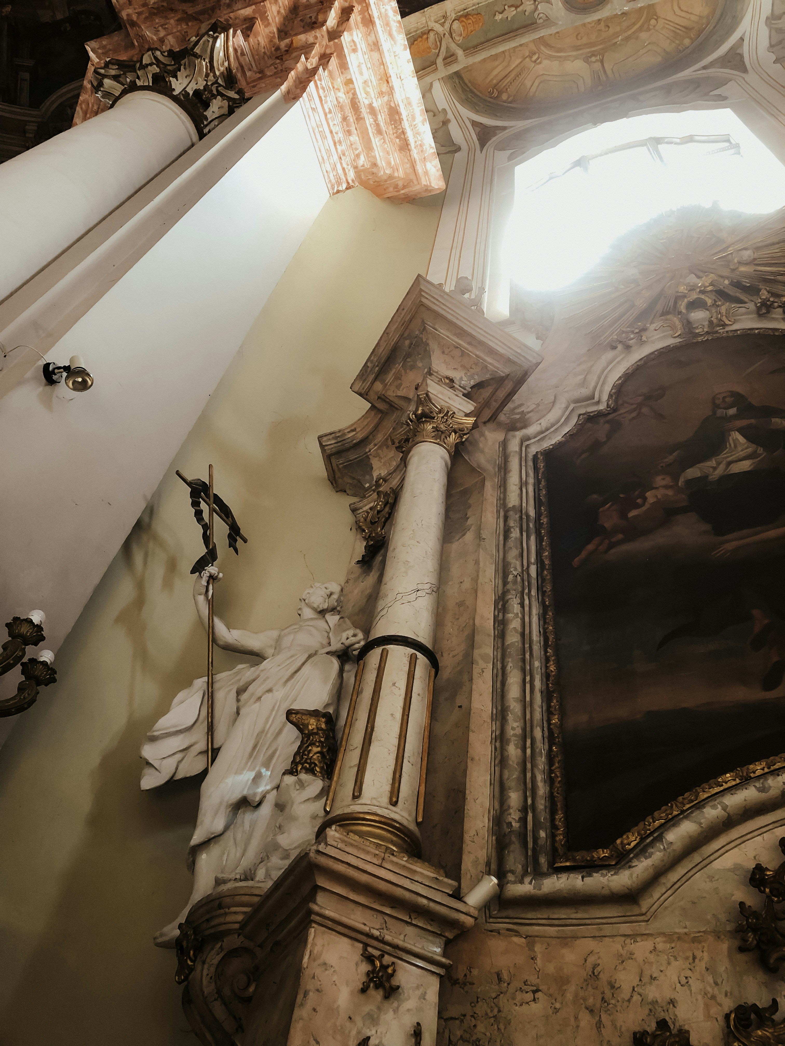 Light Between Marble Pillars: A Baroque Church Interior