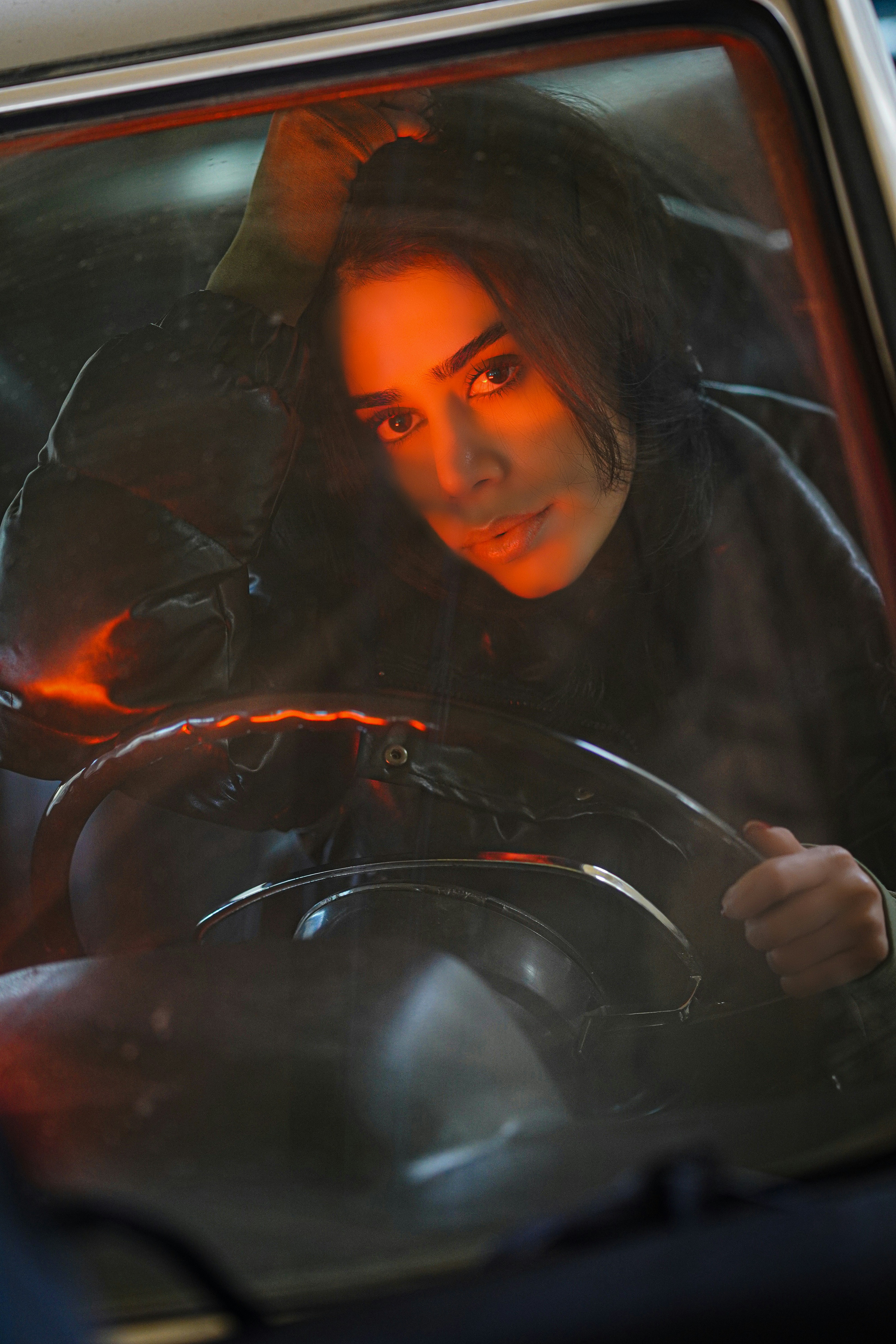 Gaze Through the Neon Glass: A Car-Window Portrait