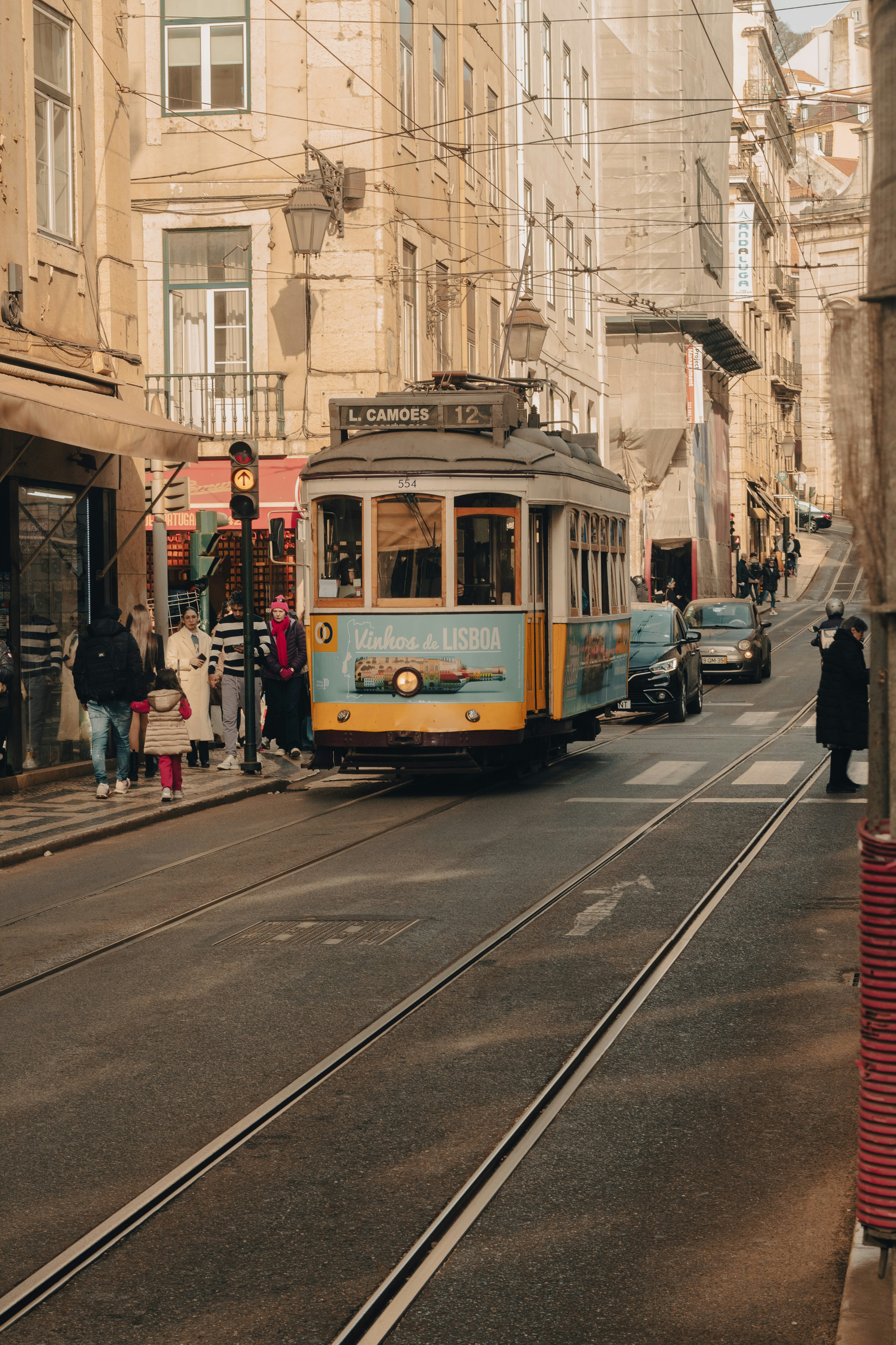 Heritage Tram on a Sunlit Lisbon Street
