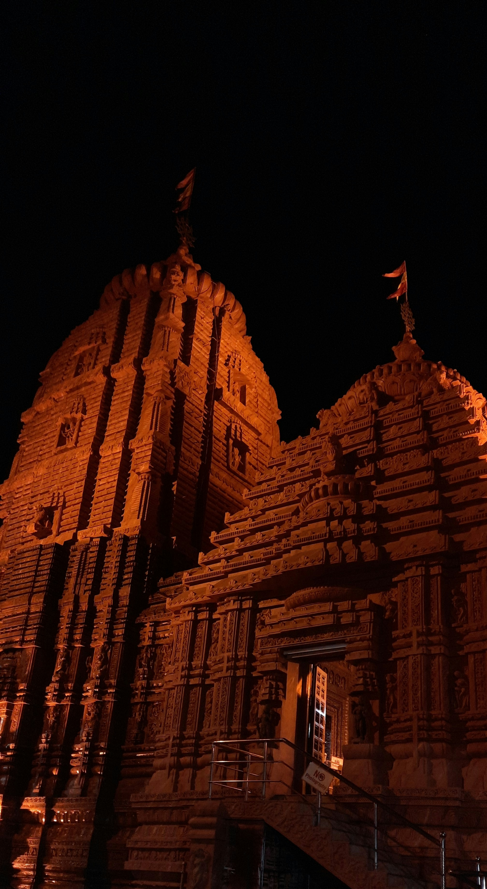 A very tall building with a clock on it's side photo – Free Jagannath ...