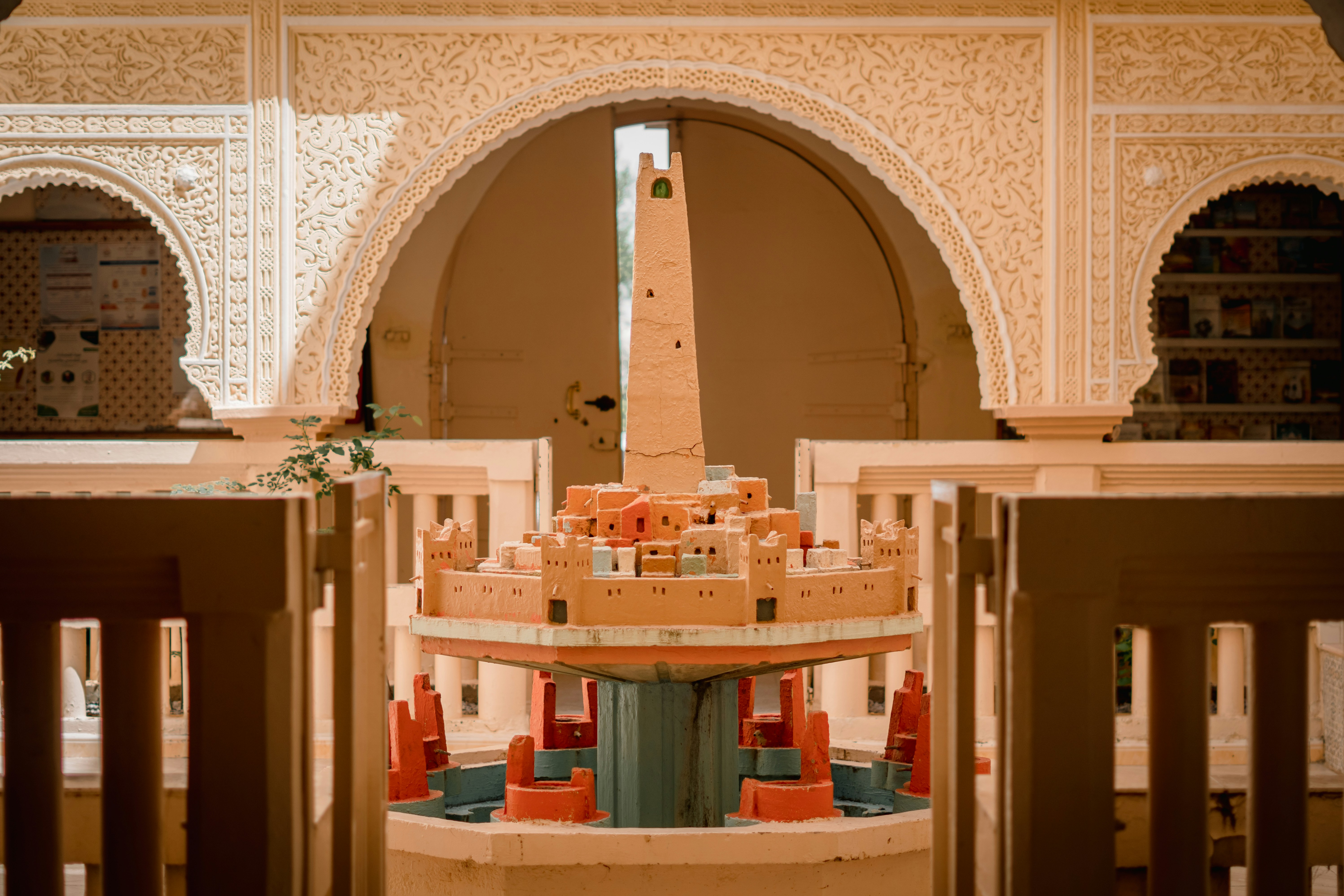 Terracotta Micro-City at the Heart of a Sunlit Archway Courtyard