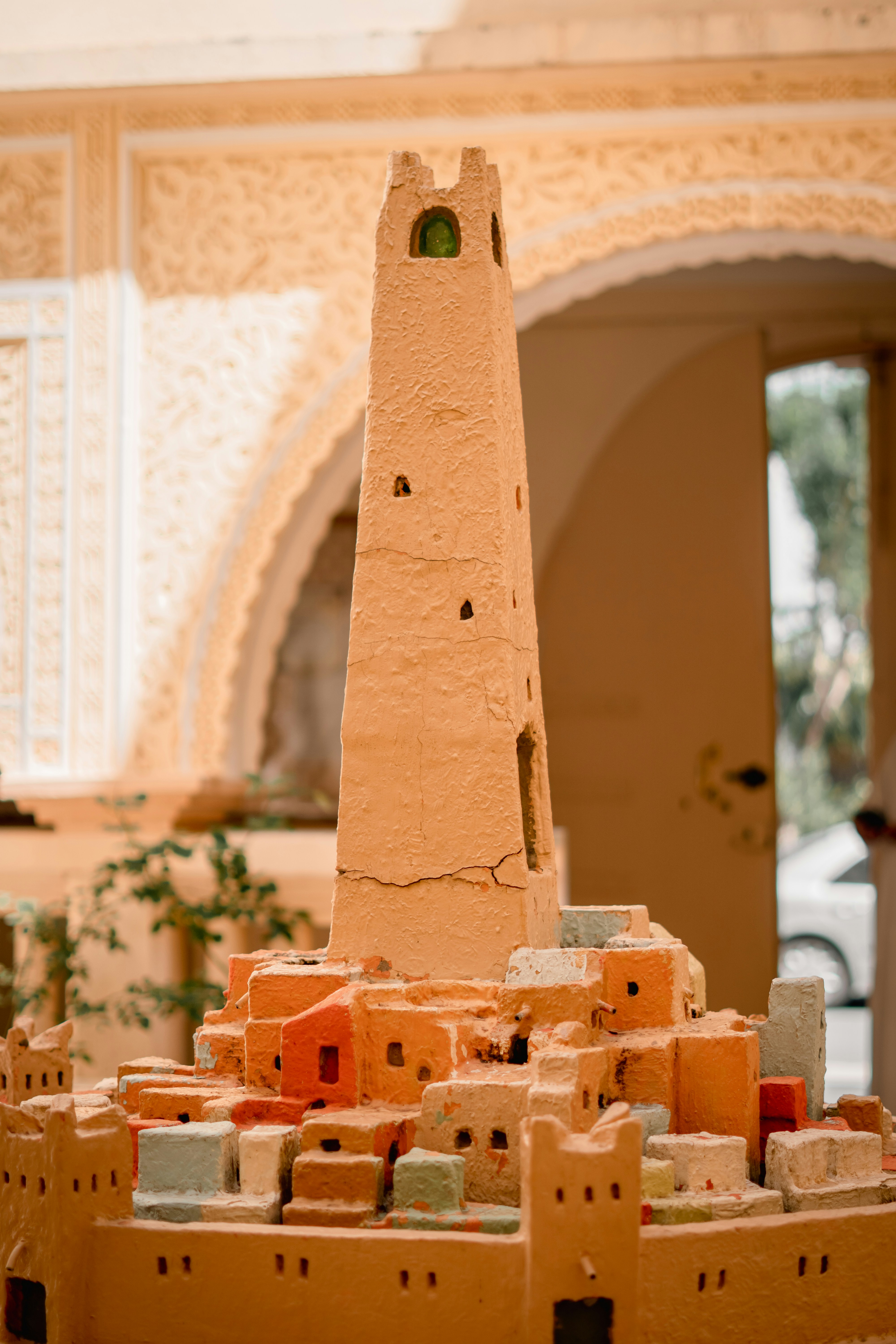 Terracotta Tower Rising from a Miniature Oasis