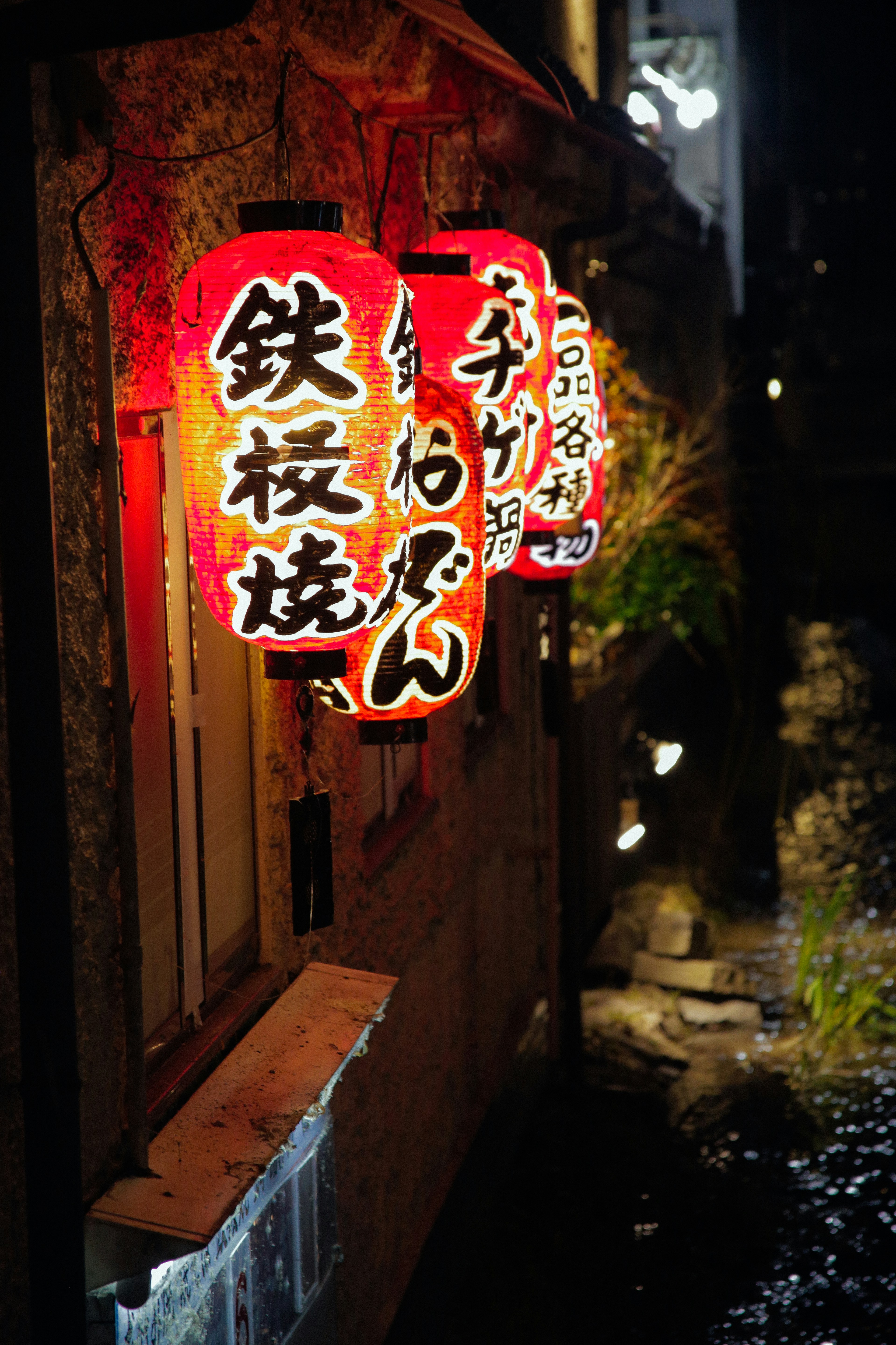 A red light hanging from the side of a building photo – Free Kyoto ...