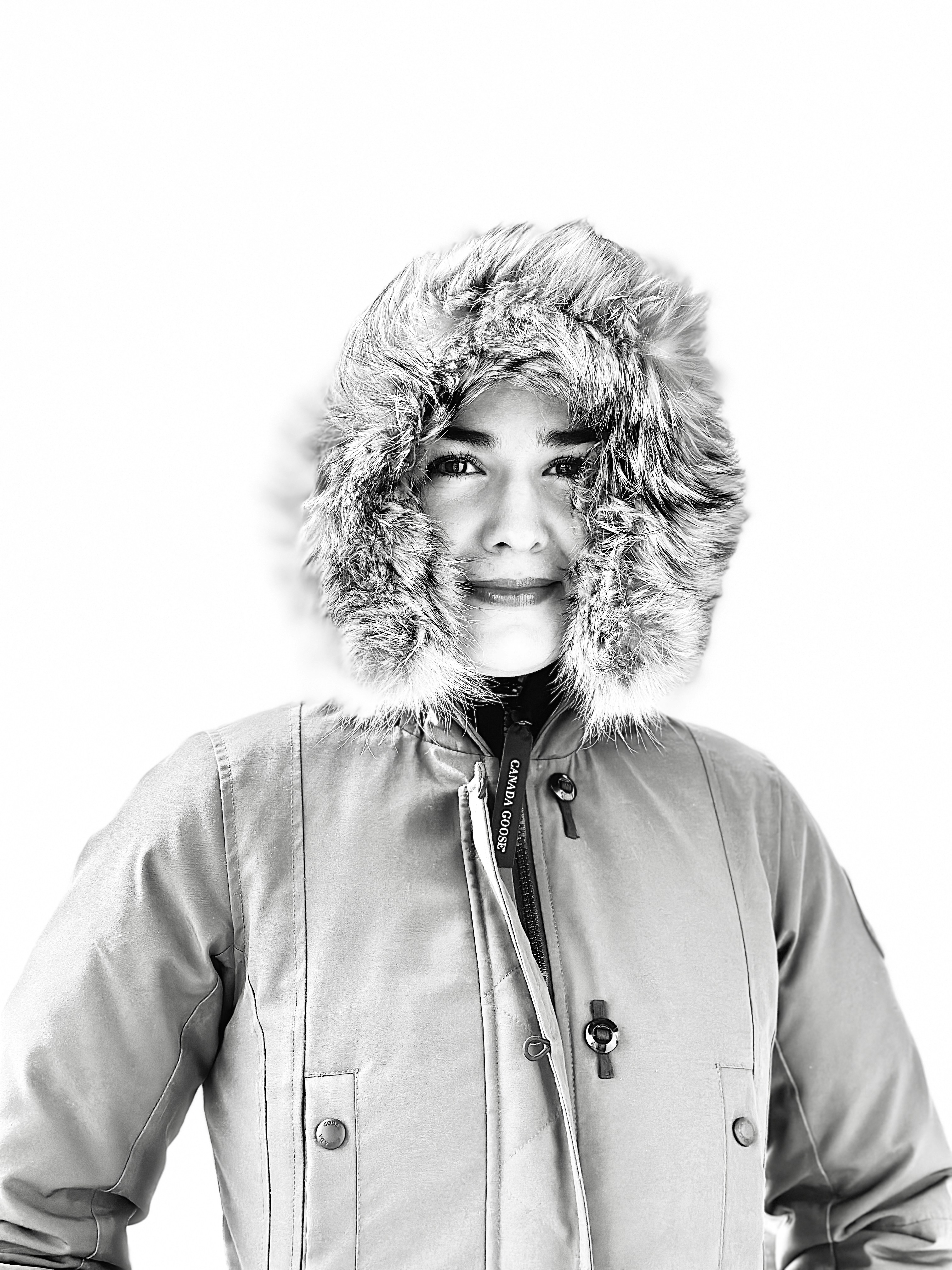 Snowbound Smile: A Monochrome Portrait in Fur and Light