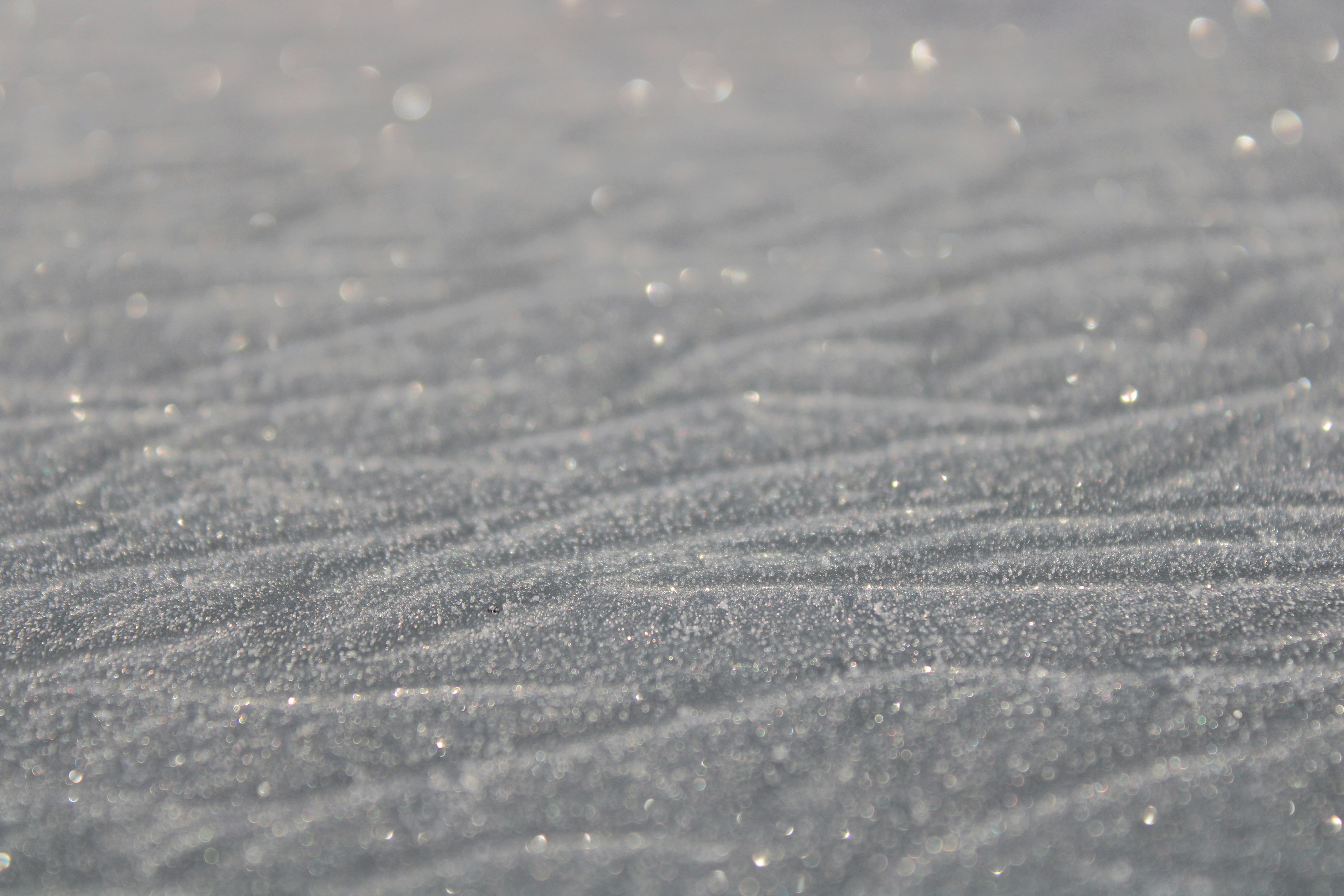 A close up of sand and water on a beach photo – Free Texture Image on ...