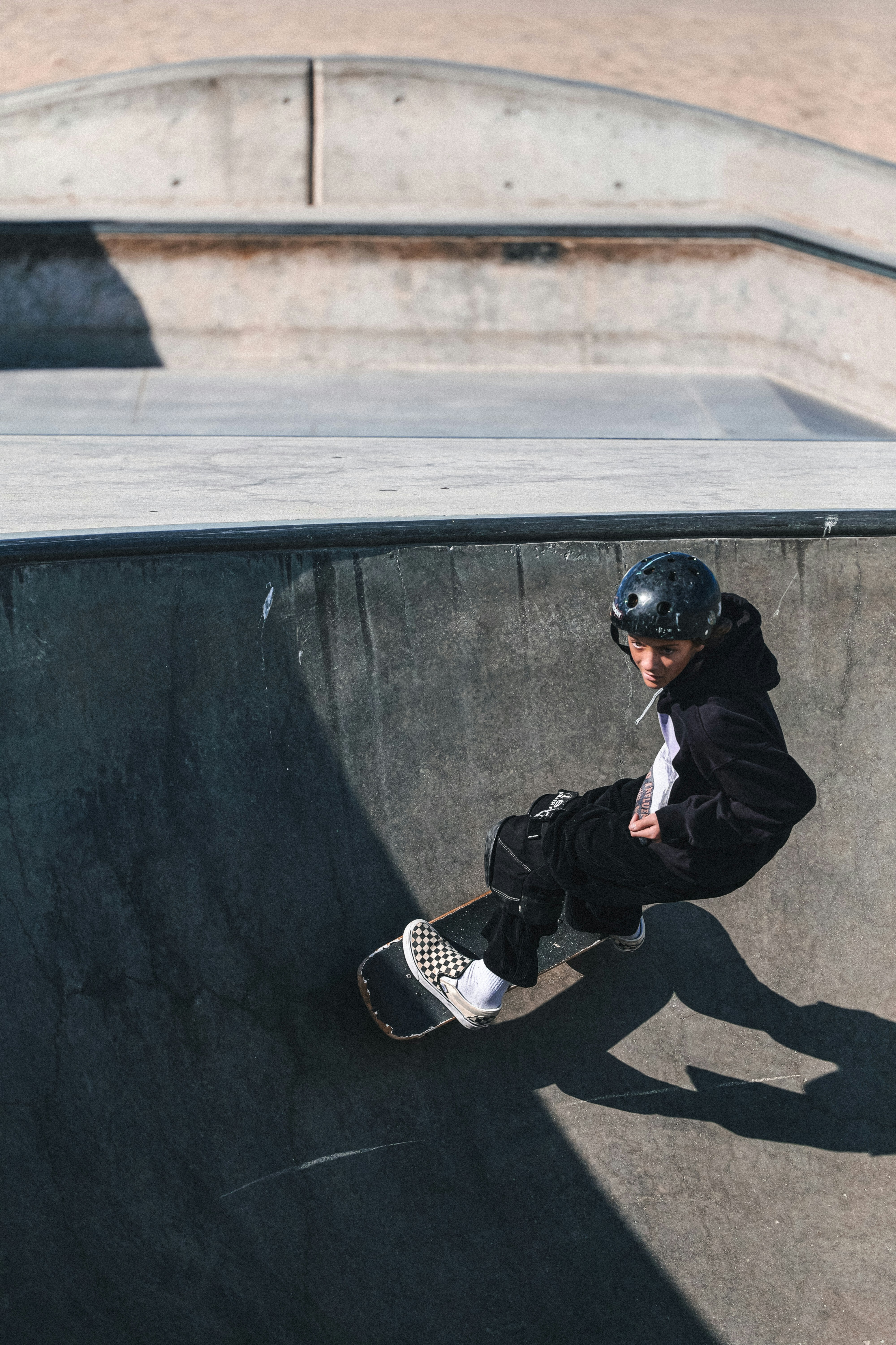 A man riding a skateboard up the side of a ramp photo – Free Venice ...