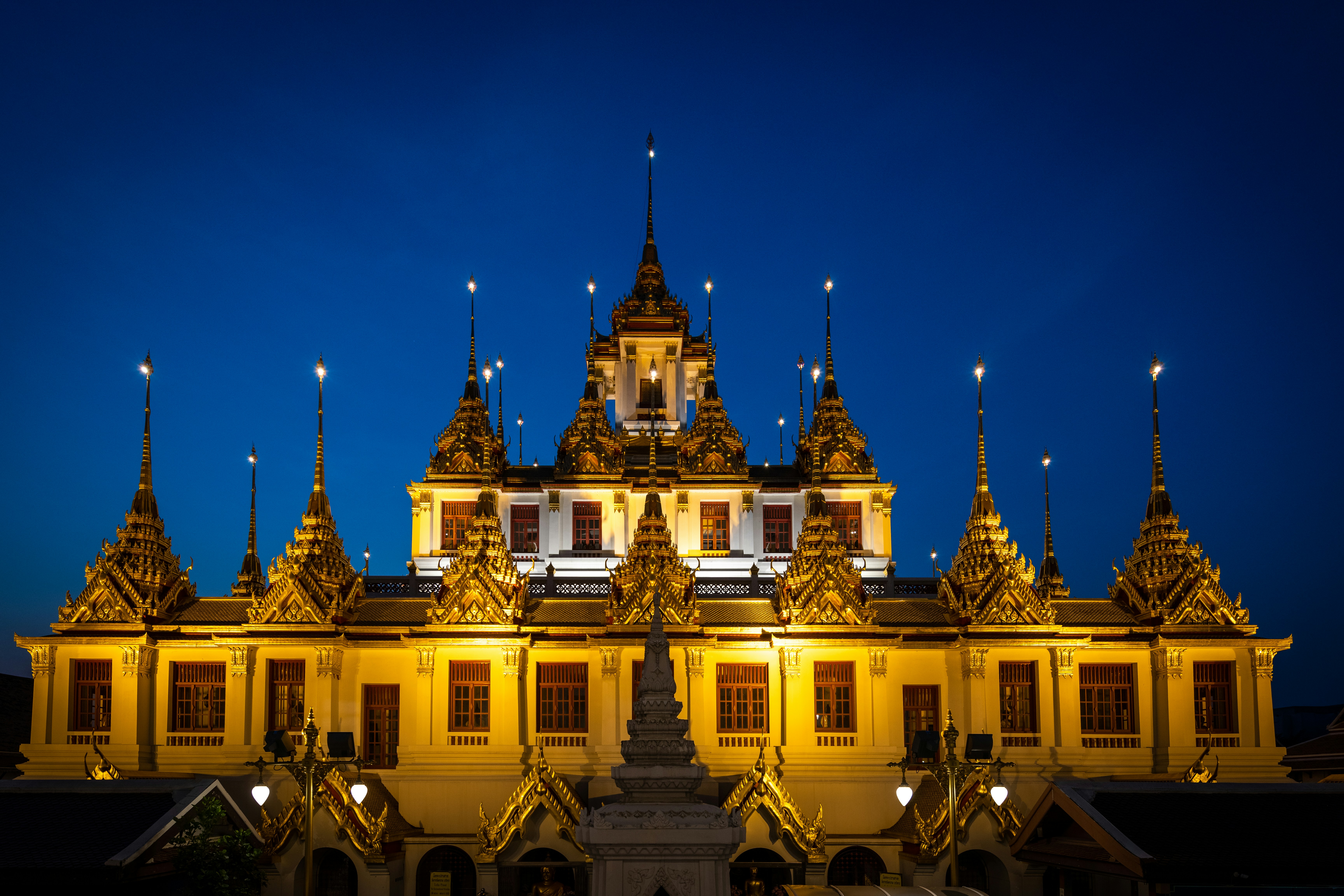 Gold-Topped Symmetry: Night Portrait of a Temple Facade