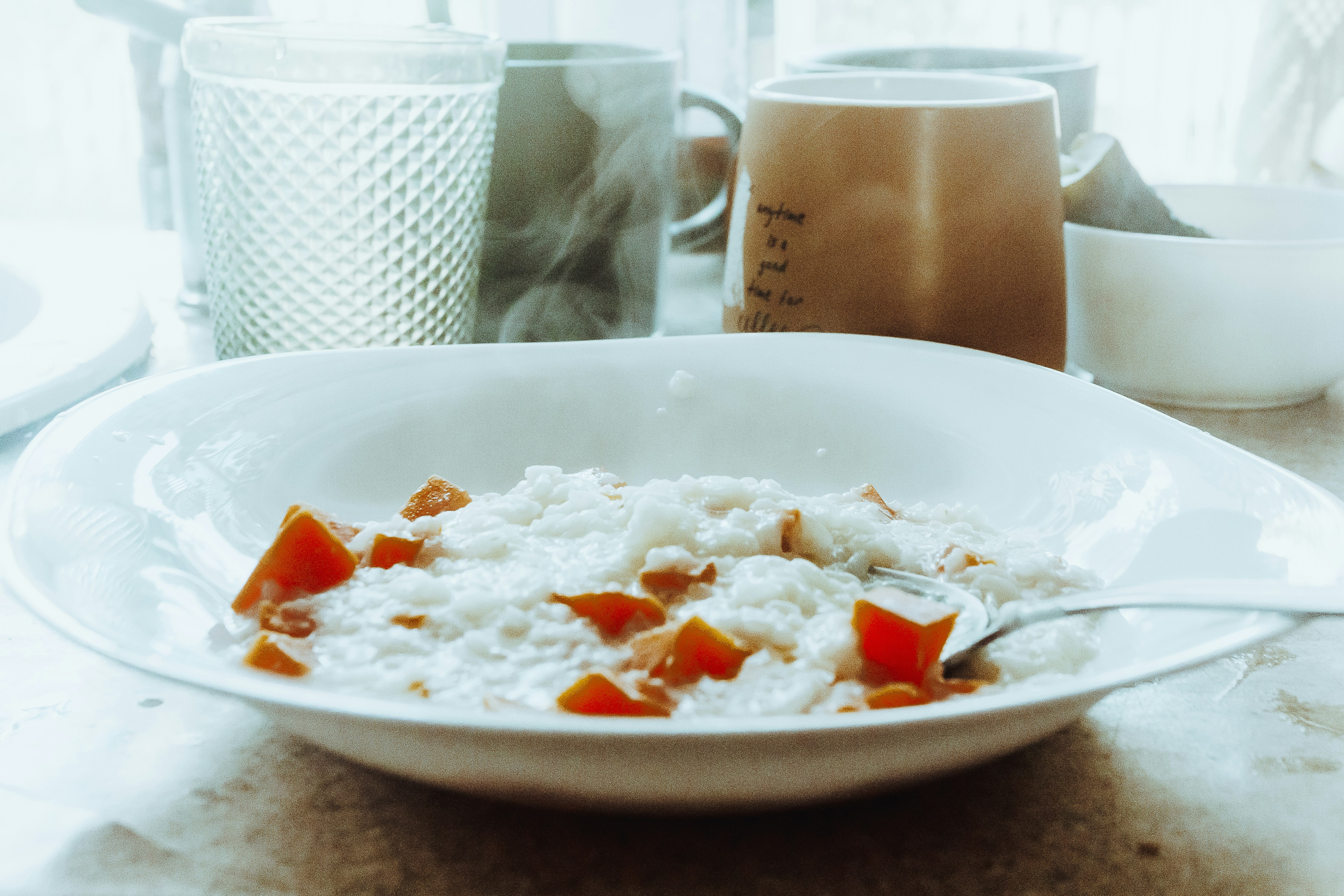 Blue-Tinted Breakfast Bowl: Creamy Yogurt with Peach Cubes on Marble
