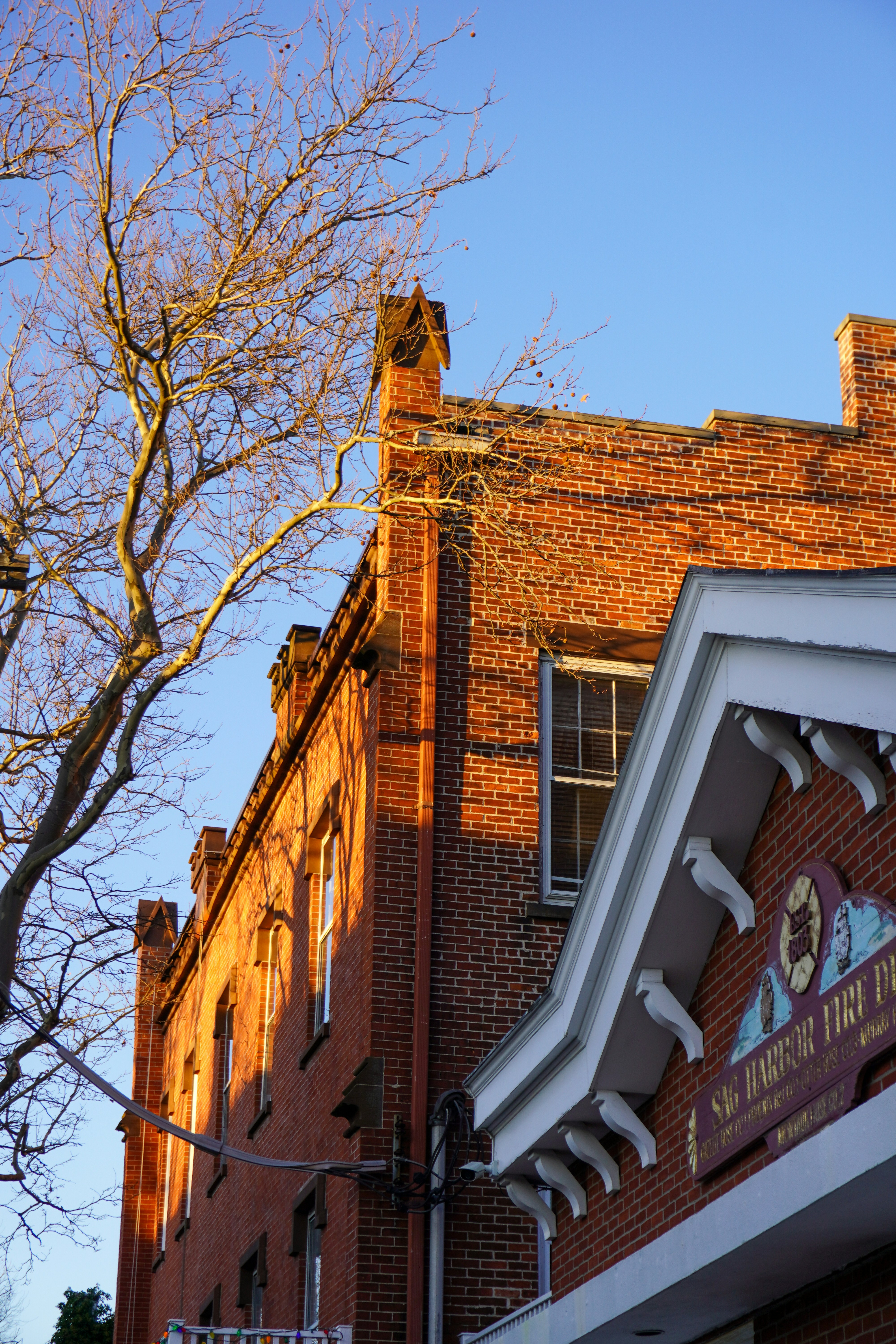 Brick Facade and Gabled Archway Beneath a Winter Sky