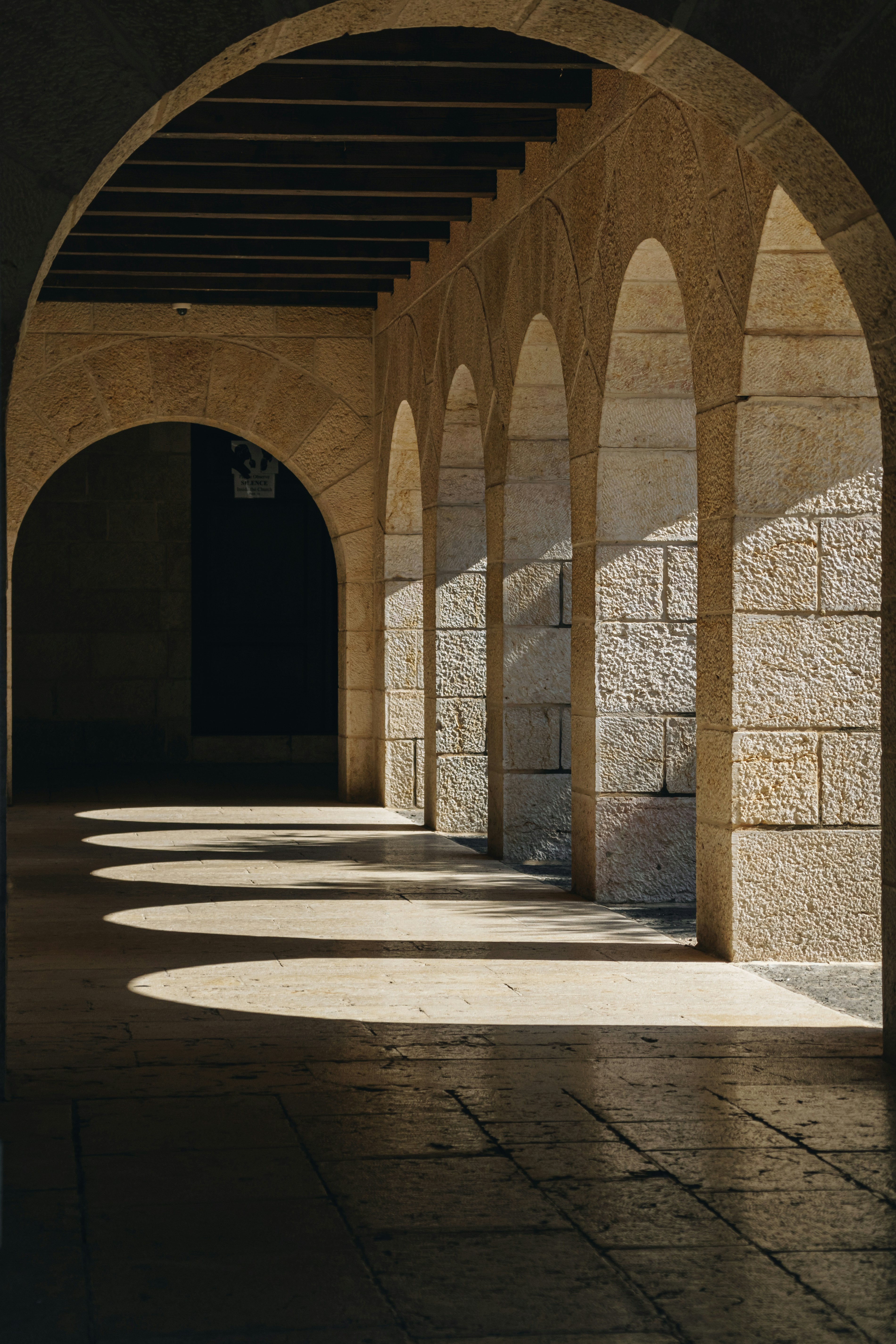 A row of arches in a stone building photo – Free Israel Image on Unsplash