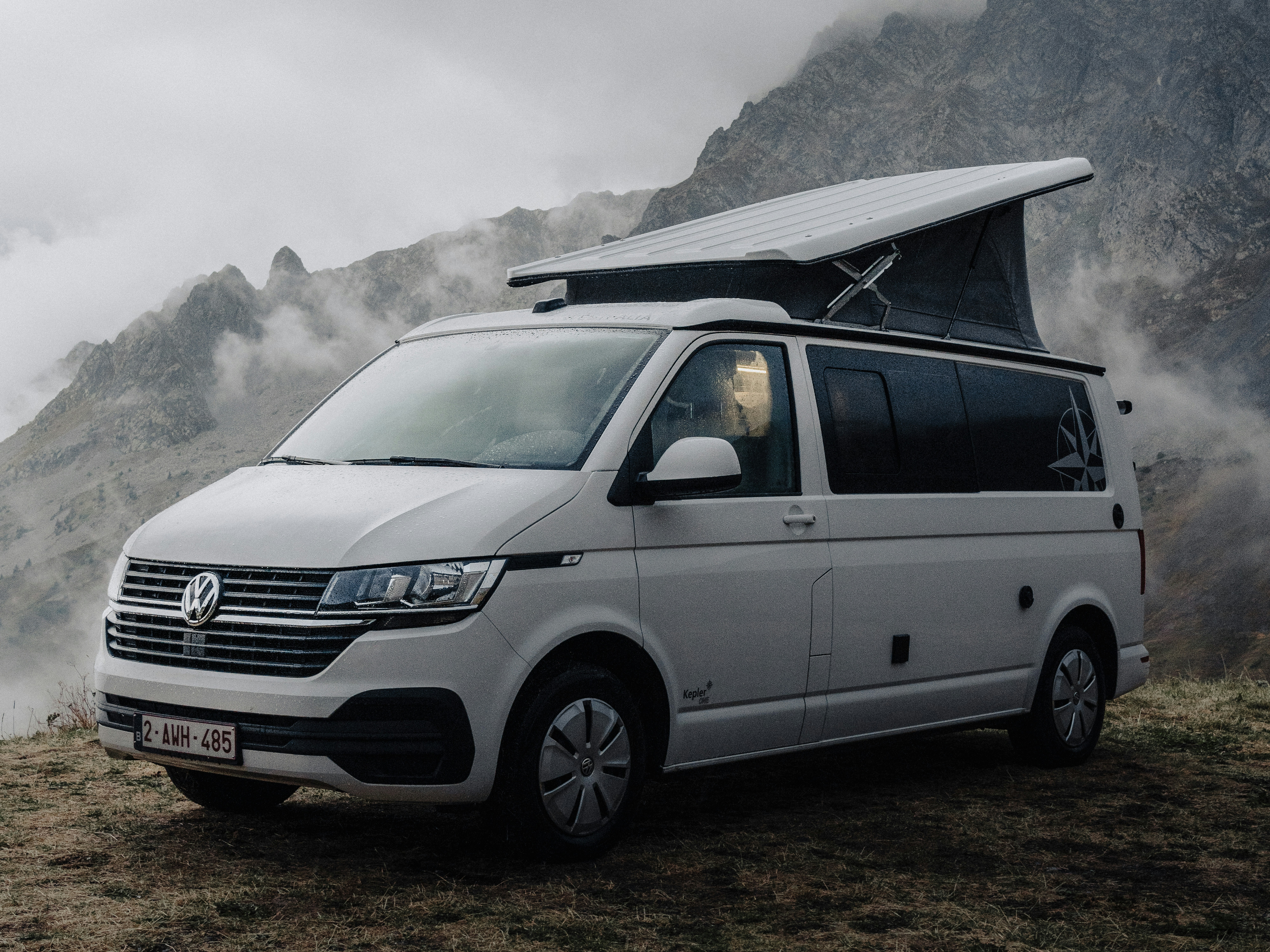 A white van parked in front of a mountain photo – Free Vehicle Image on ...