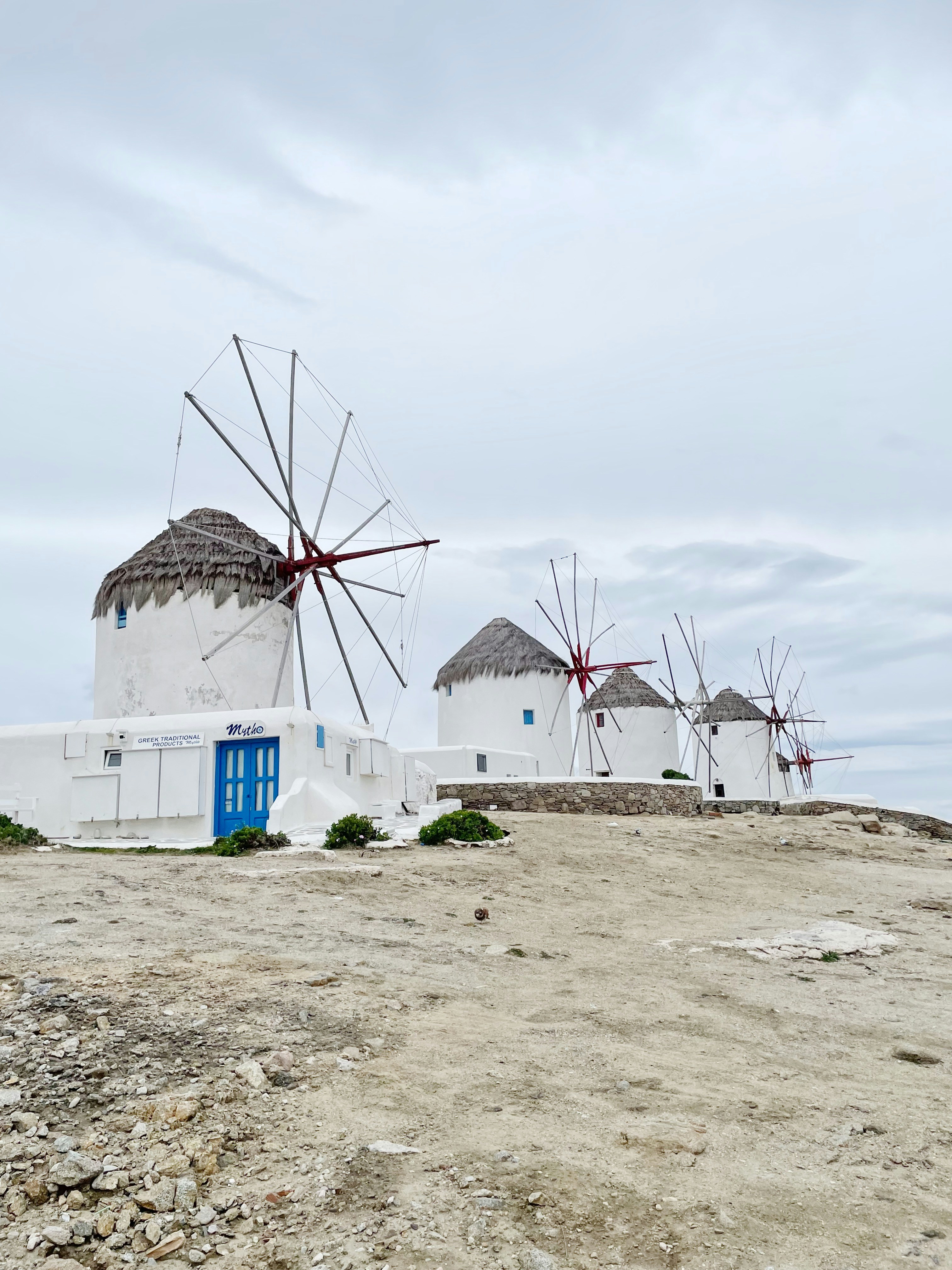 White Windmills in a Quiet Line Along the Grey Shore