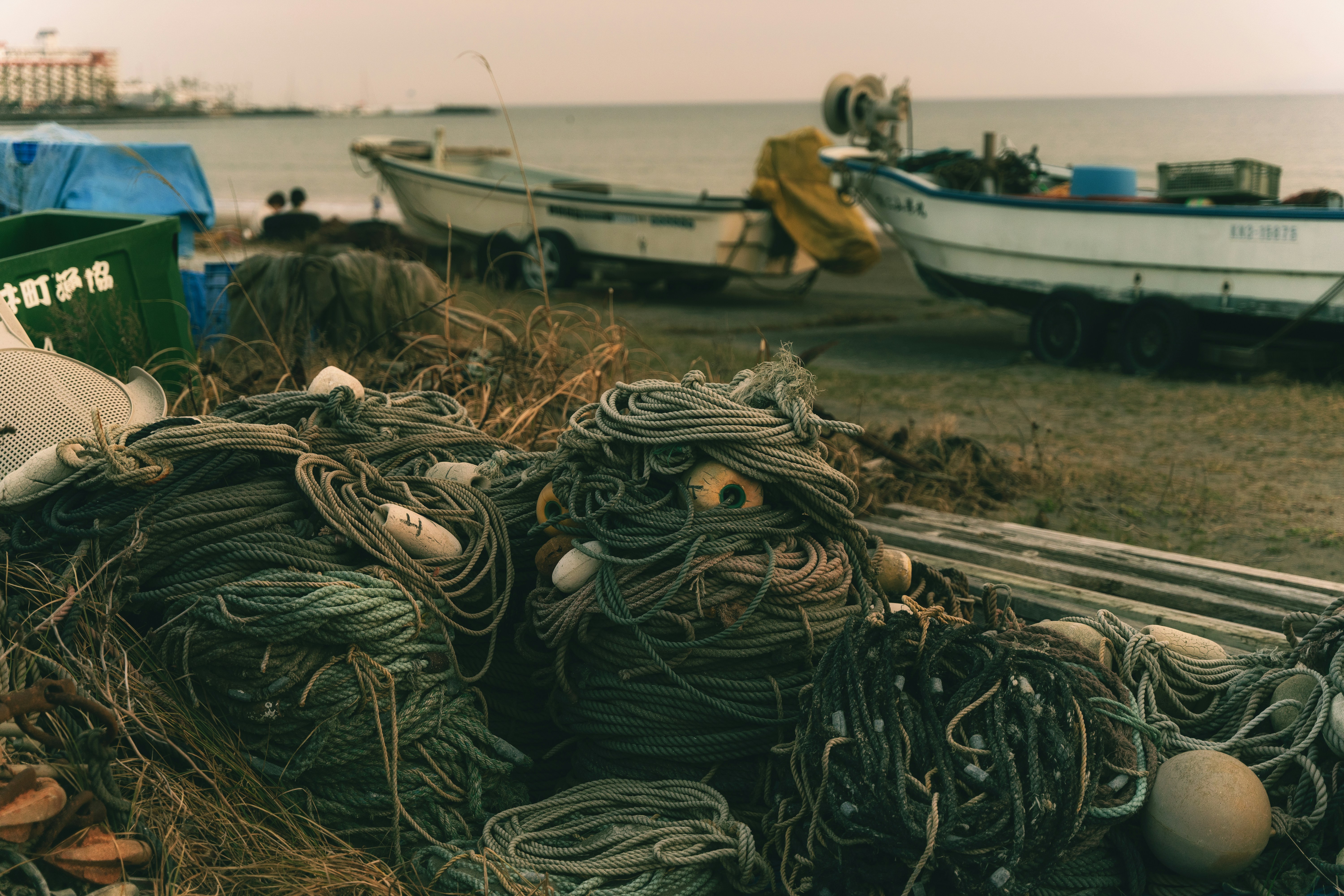Silent Wharf: Tangles of Rope Beneath Quiet Boats at Dusk
