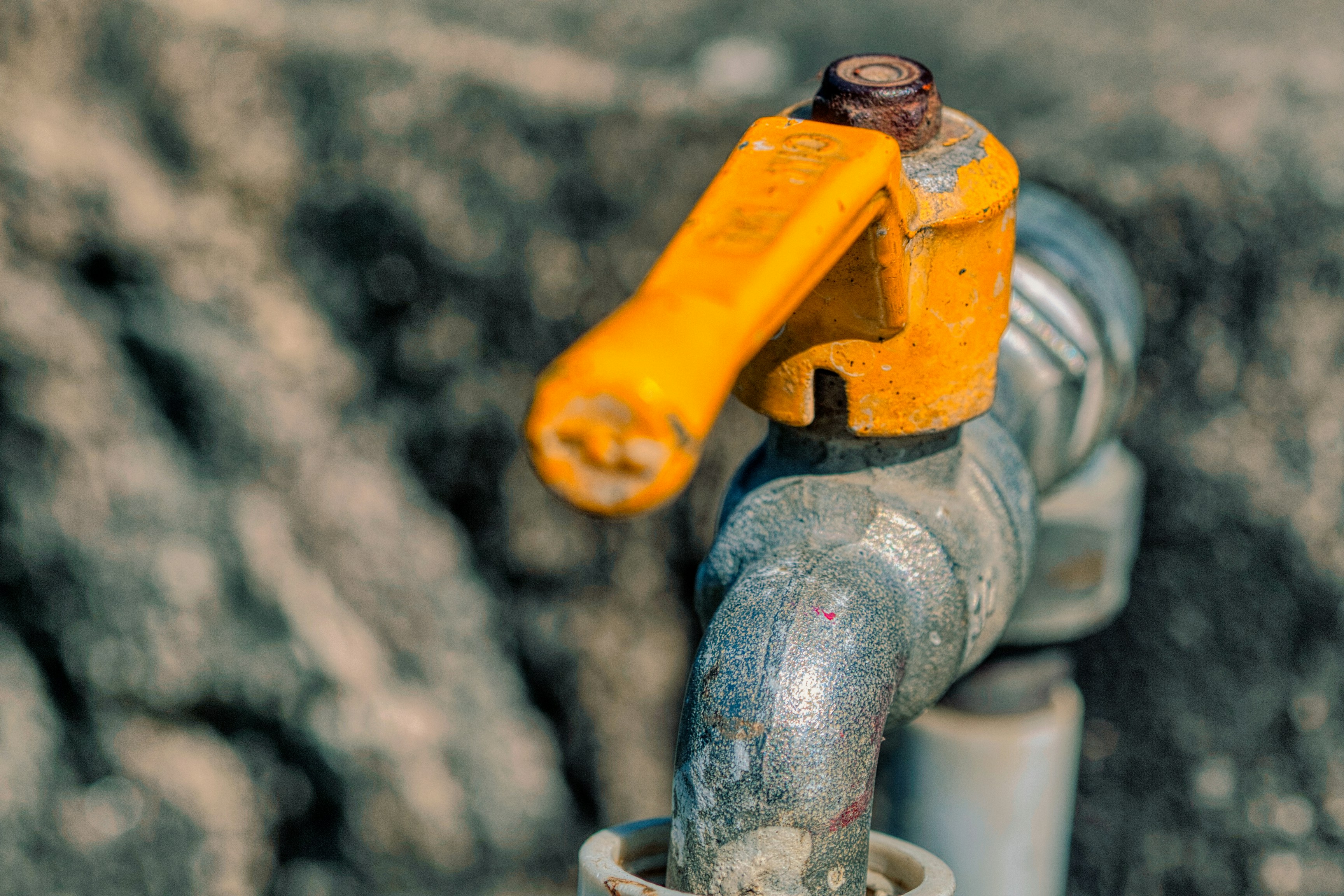 A close up of a fire hydrant with a yellow handle photo – Free Rust ...