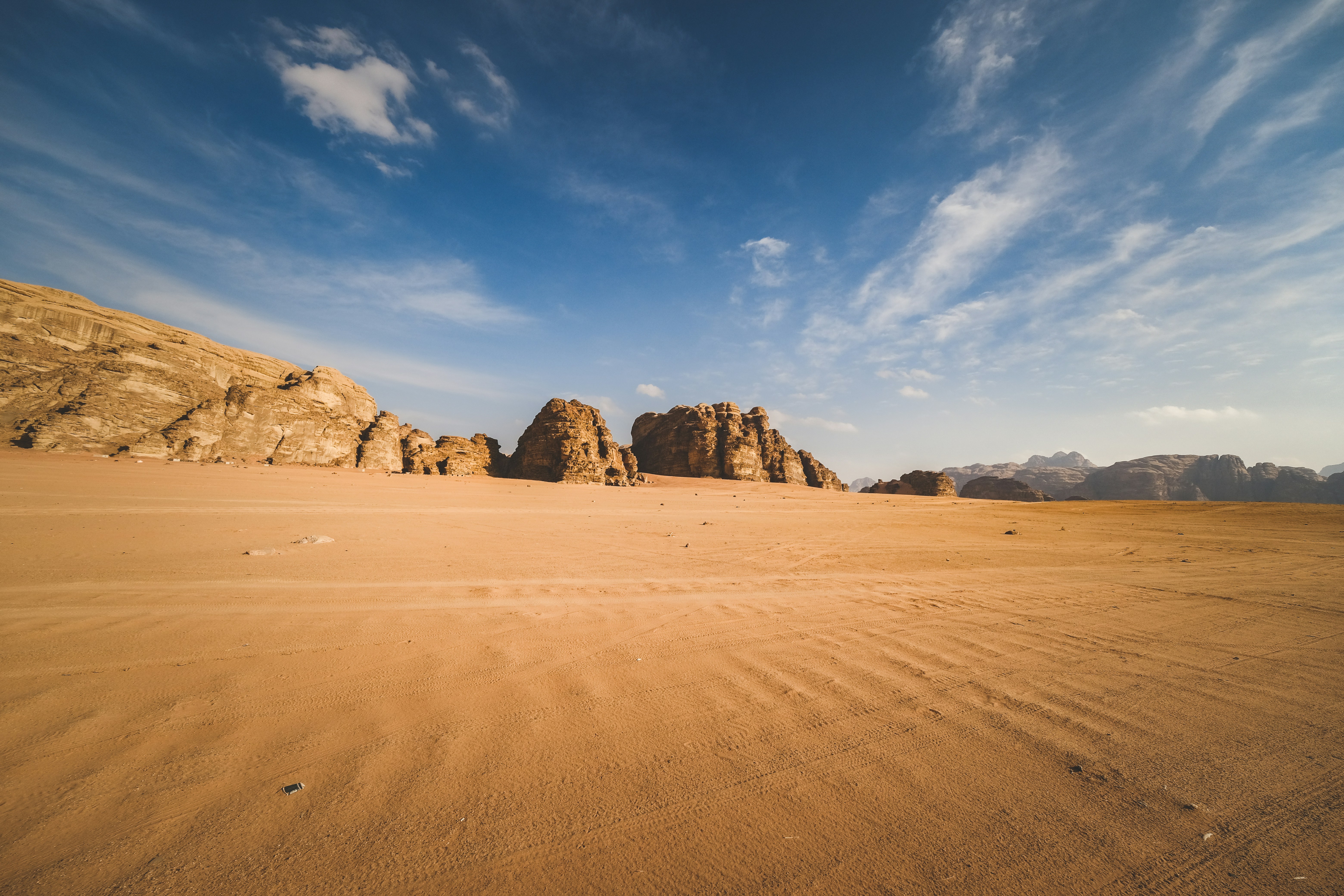A desert landscape with rocks and sand photo – Free Nature Image on ...