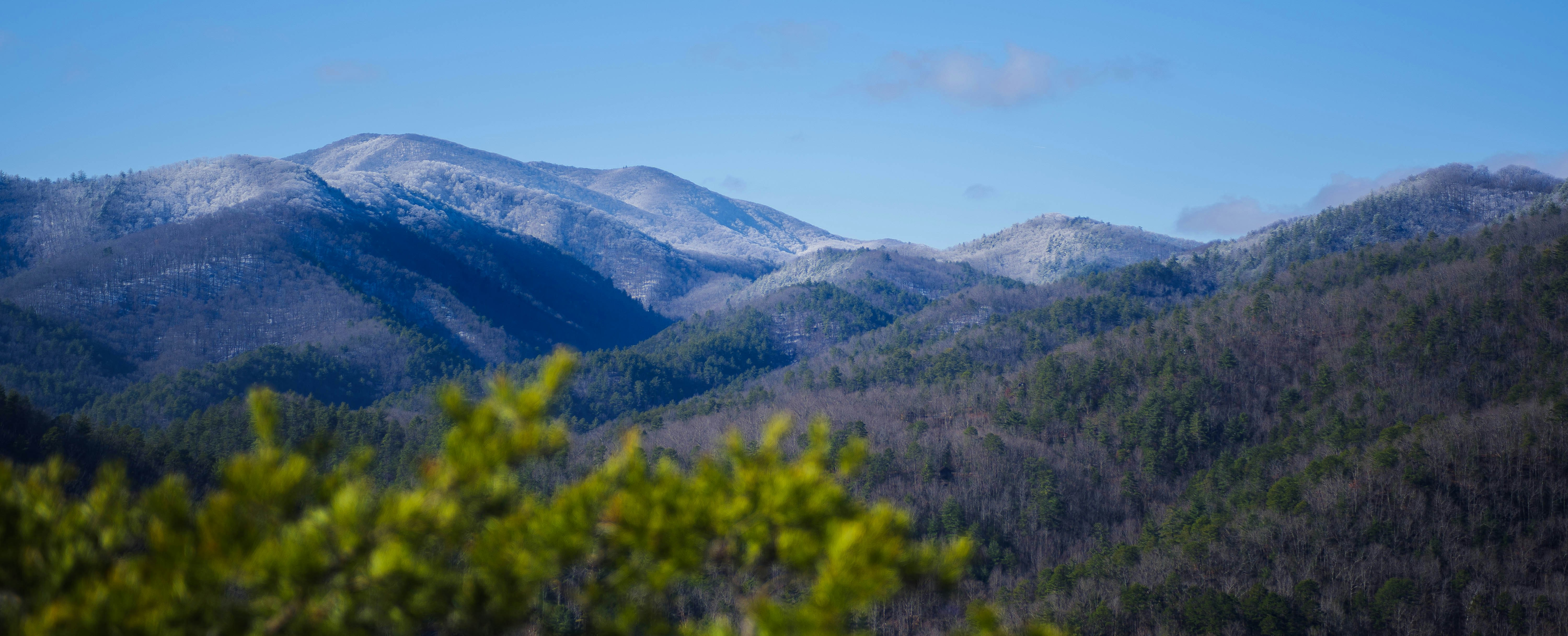 Snow-Capped Ridge under a Quiet Blue Morning